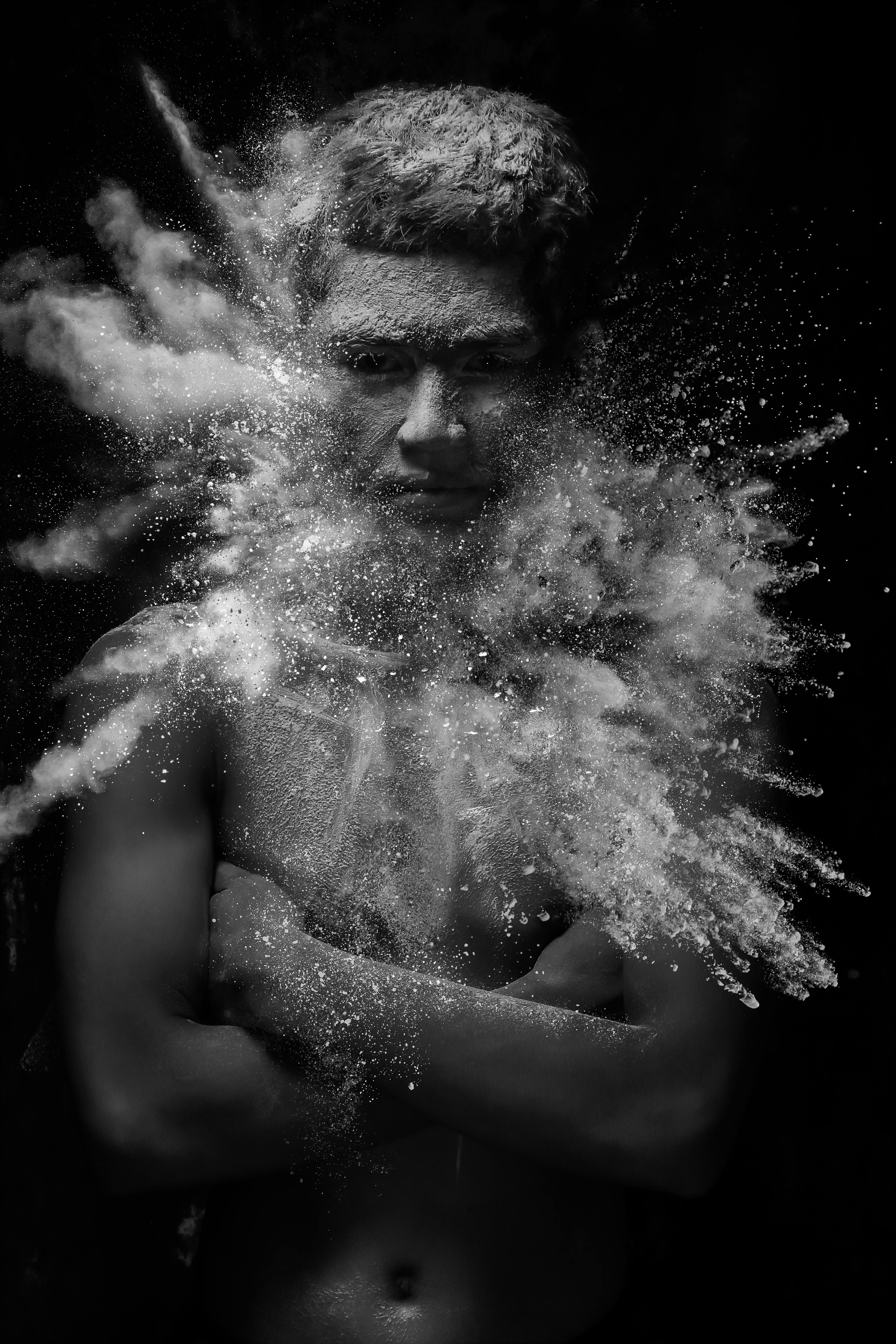 Black and White Portrait of Man and Splashed Powder · Free Stock Photo