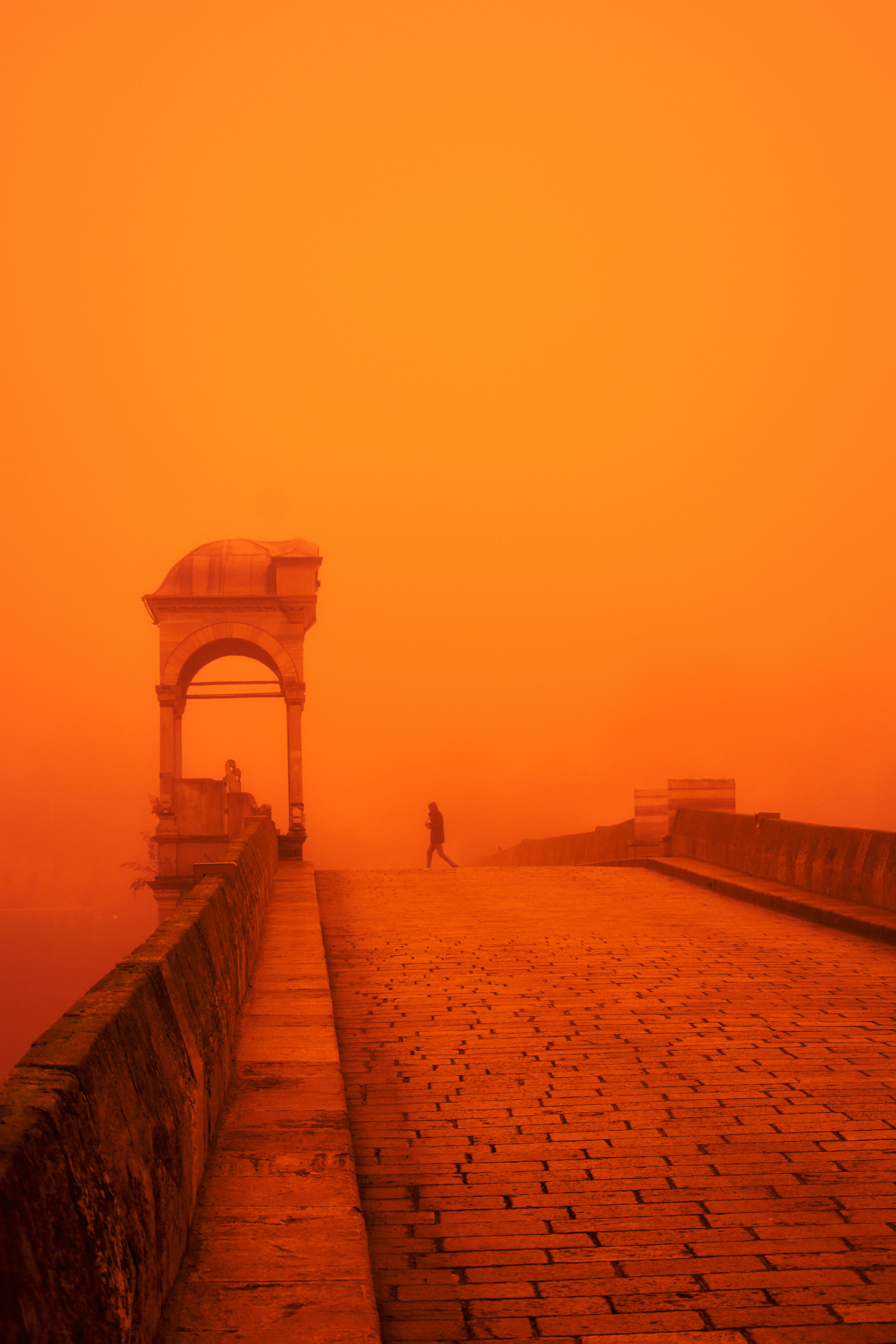 Person Standing on a Bridge in the Fog · Free Stock Photo
