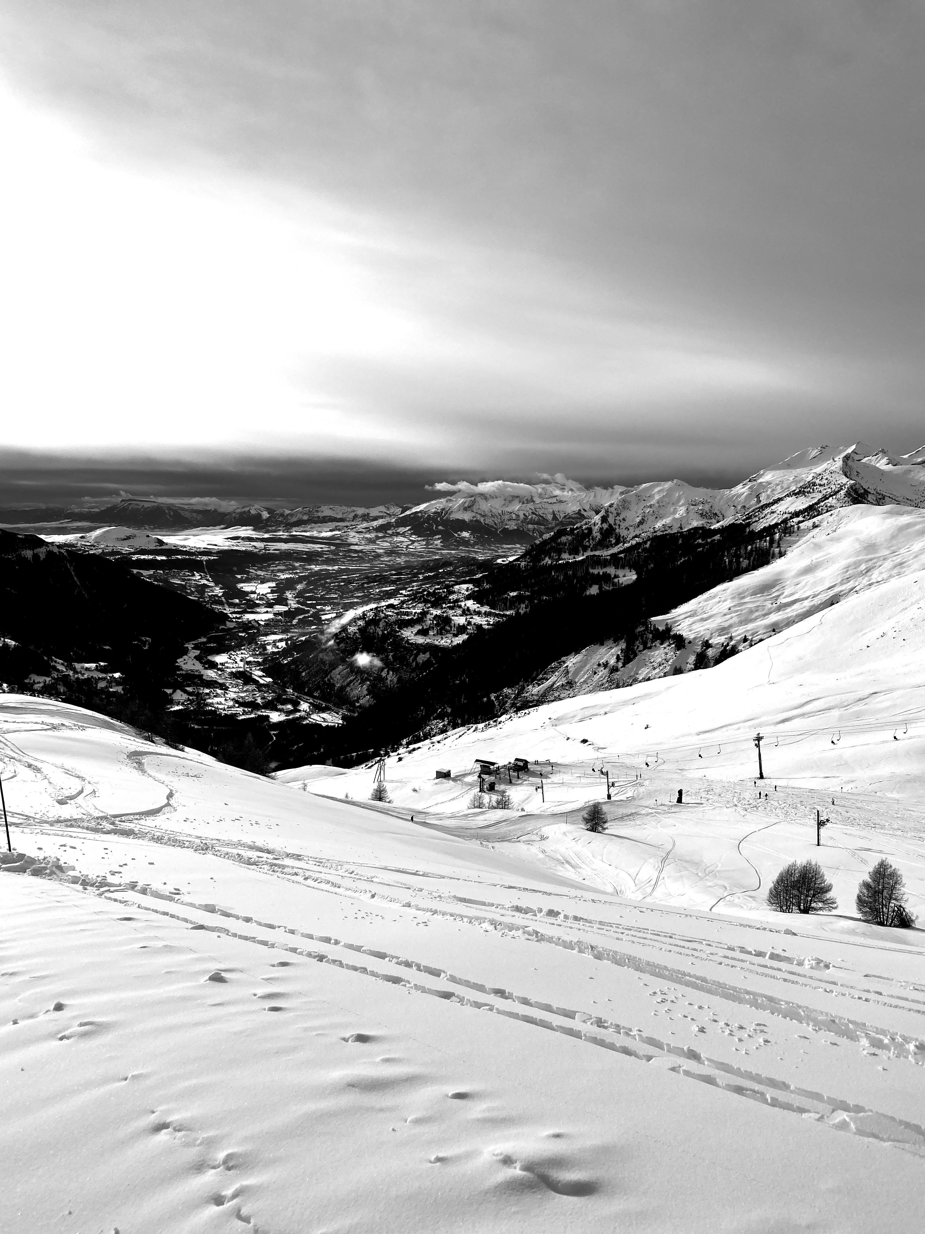 Grayscale Photo of a Snow-Covered Mountain · Free Stock Photo