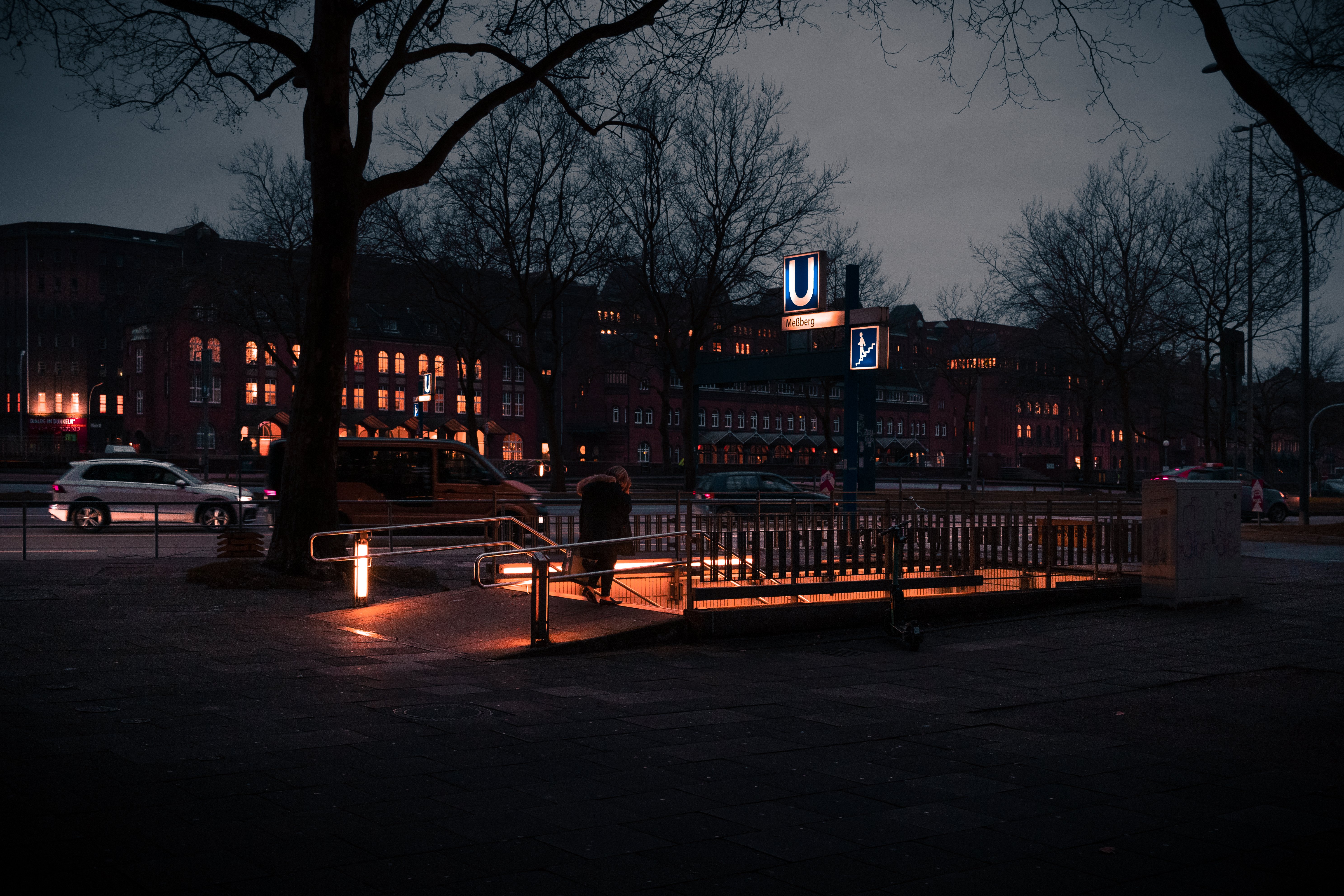 A Person Going Down the Stairs during Evening Time · Free Stock Photo