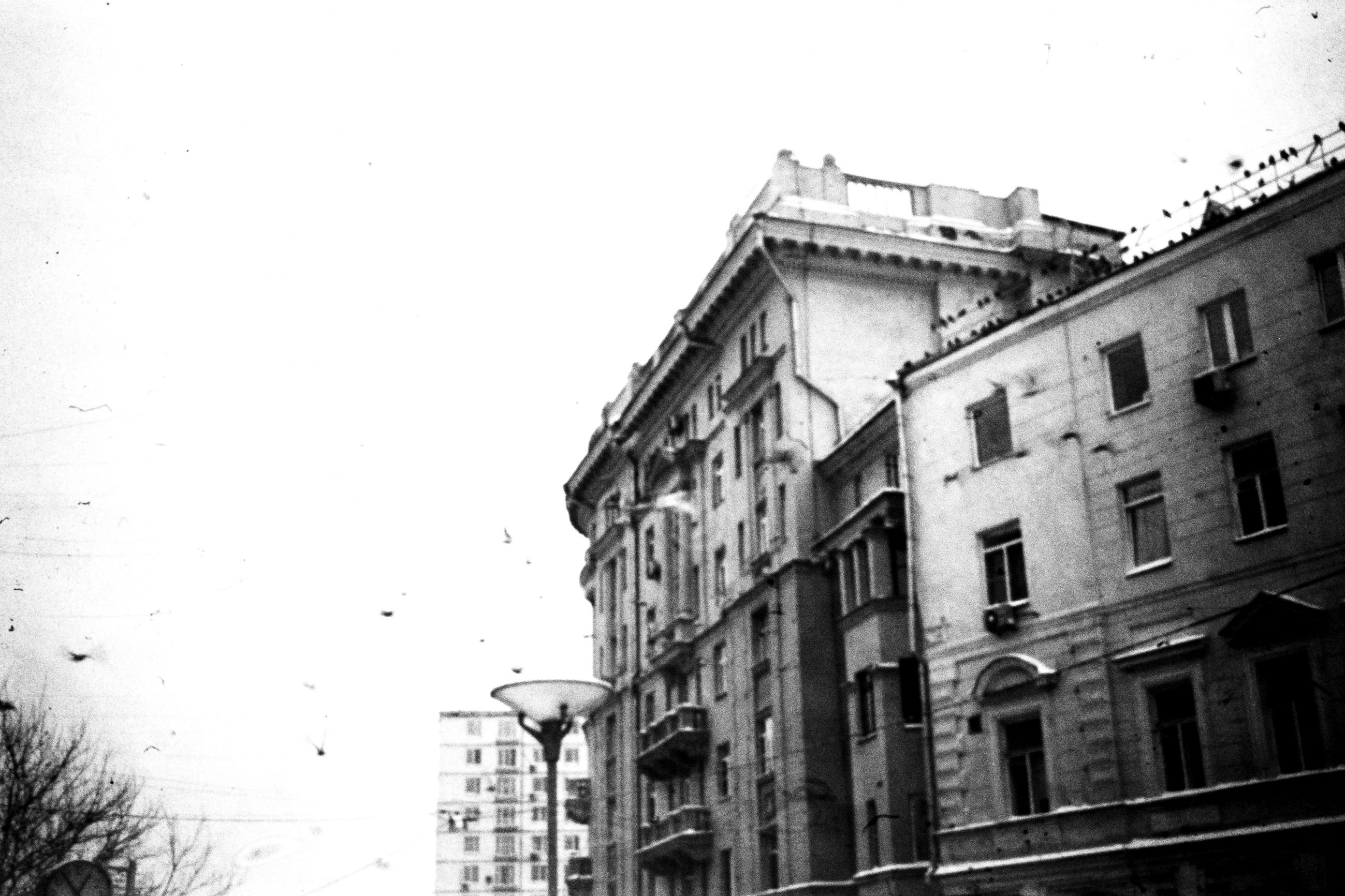 Grayscale Photo of Old Apartment Buildings · Free Stock Photo