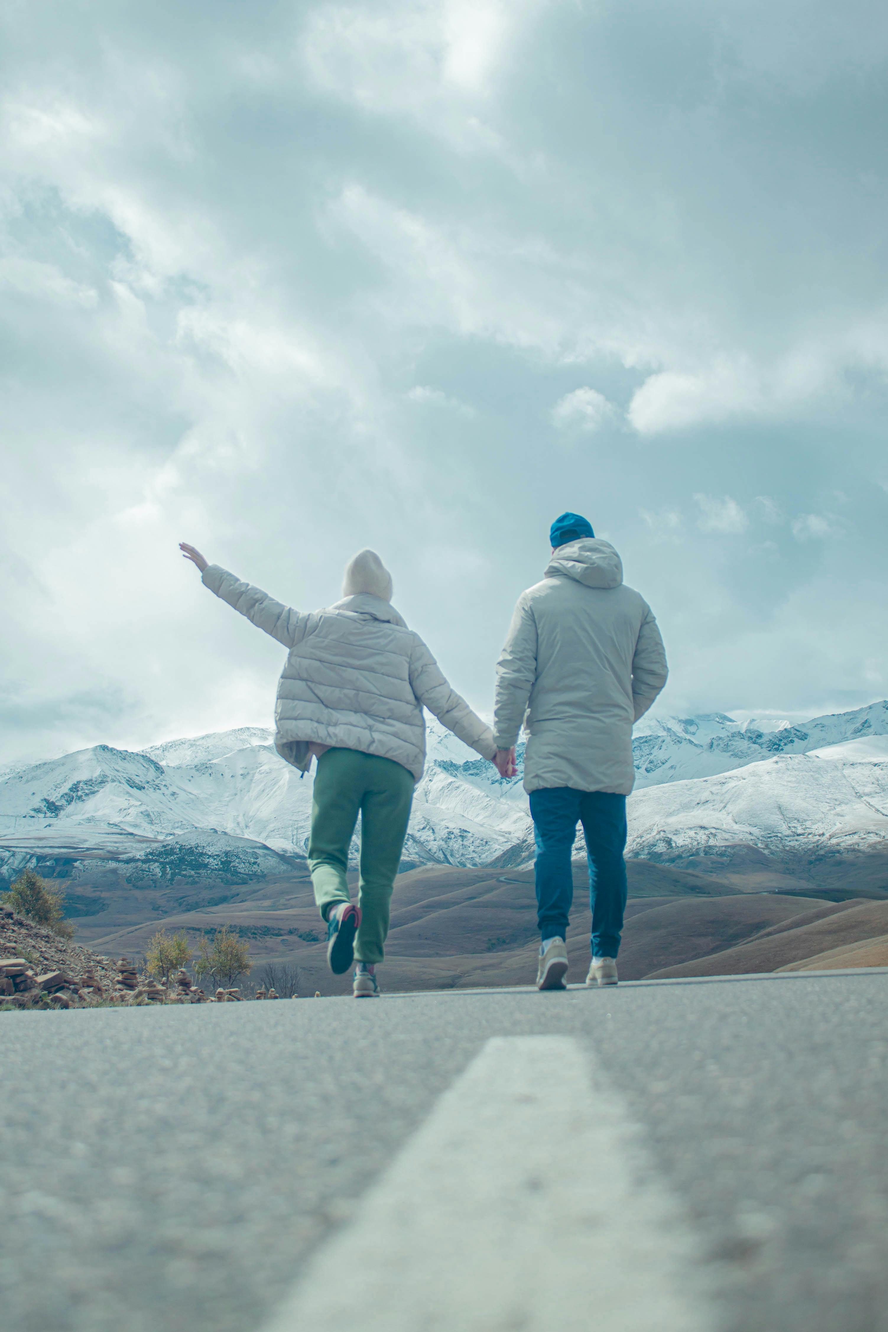 People Walking on the Road while Holding Each Others Hand · Free Stock ...