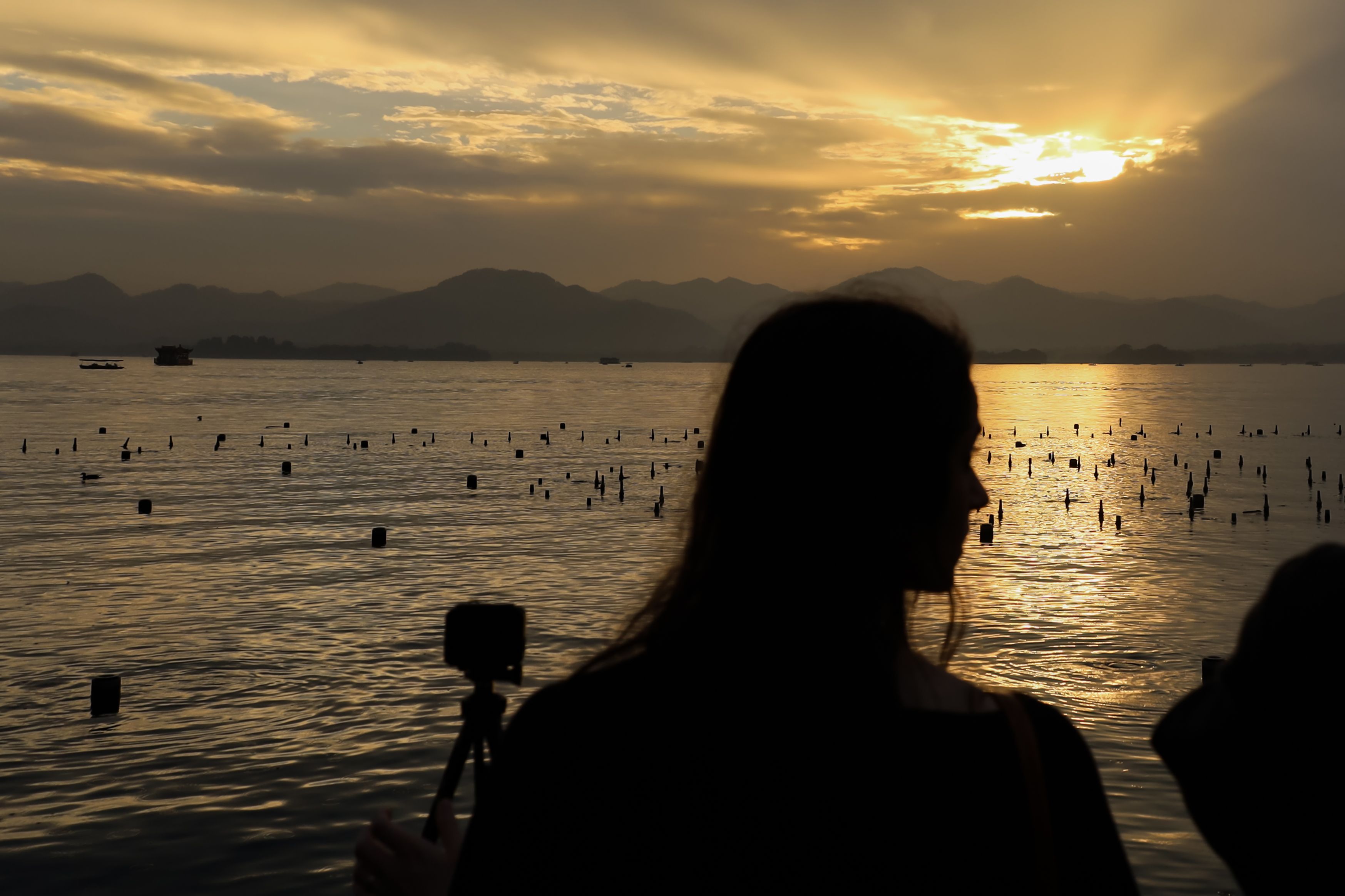Woman and Lake at Sunset · Free Stock Photo