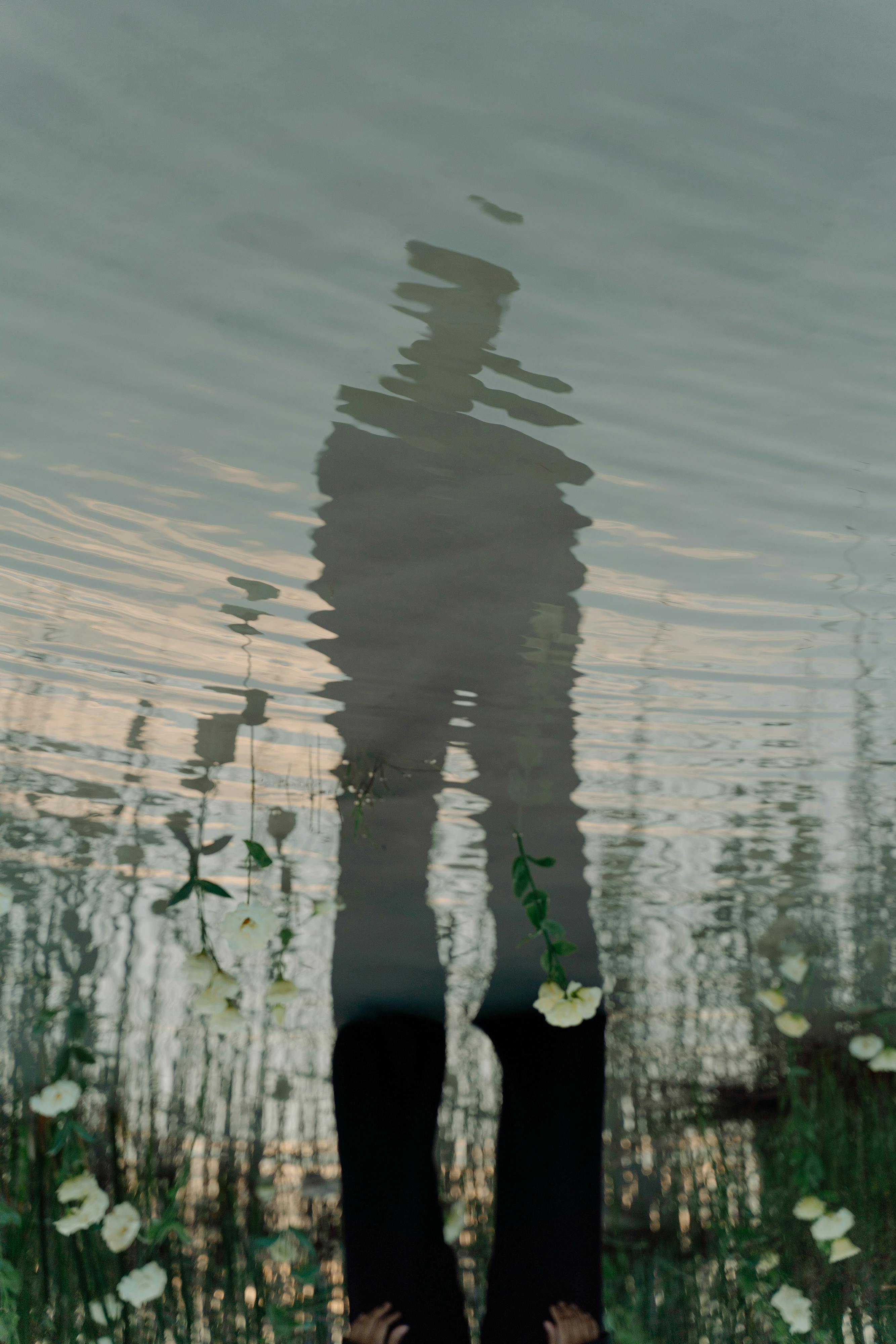 Reflection of a Person in the Water · Free Stock Photo