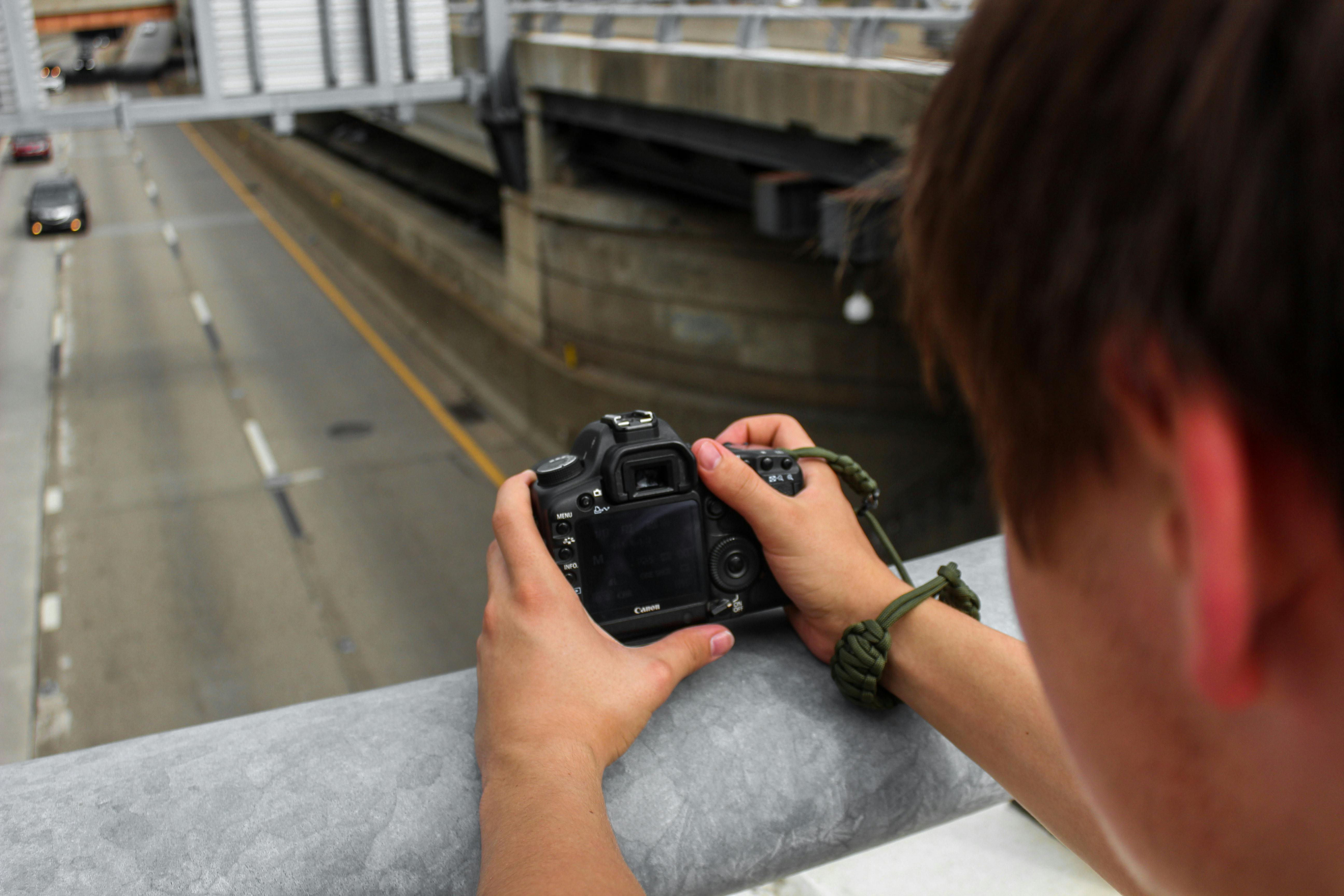 Person Holding Dslr Camera · Free Stock Photo