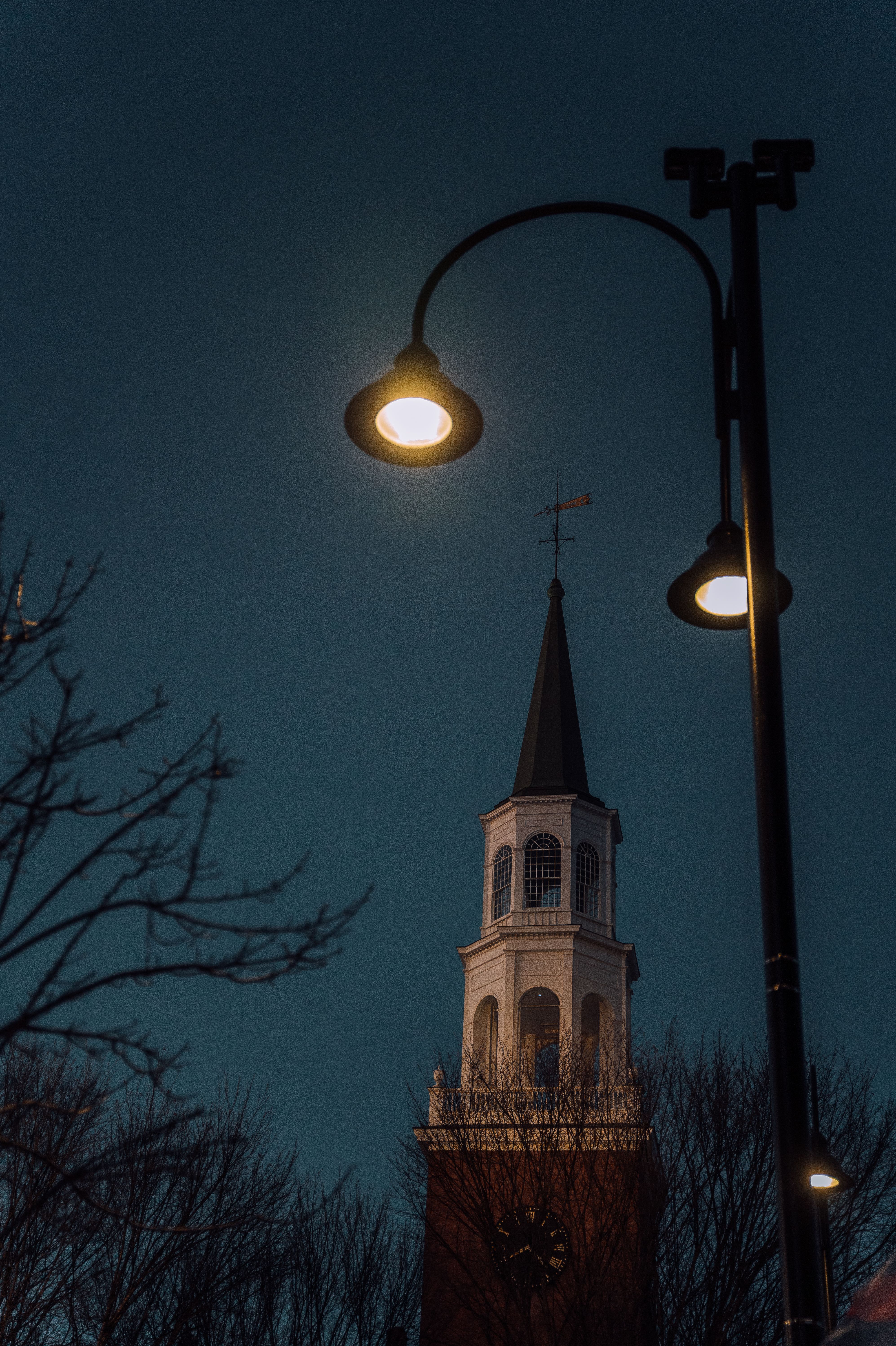 Low-Angle Shot of Street Lights near Clock Tower during Nighttime ...