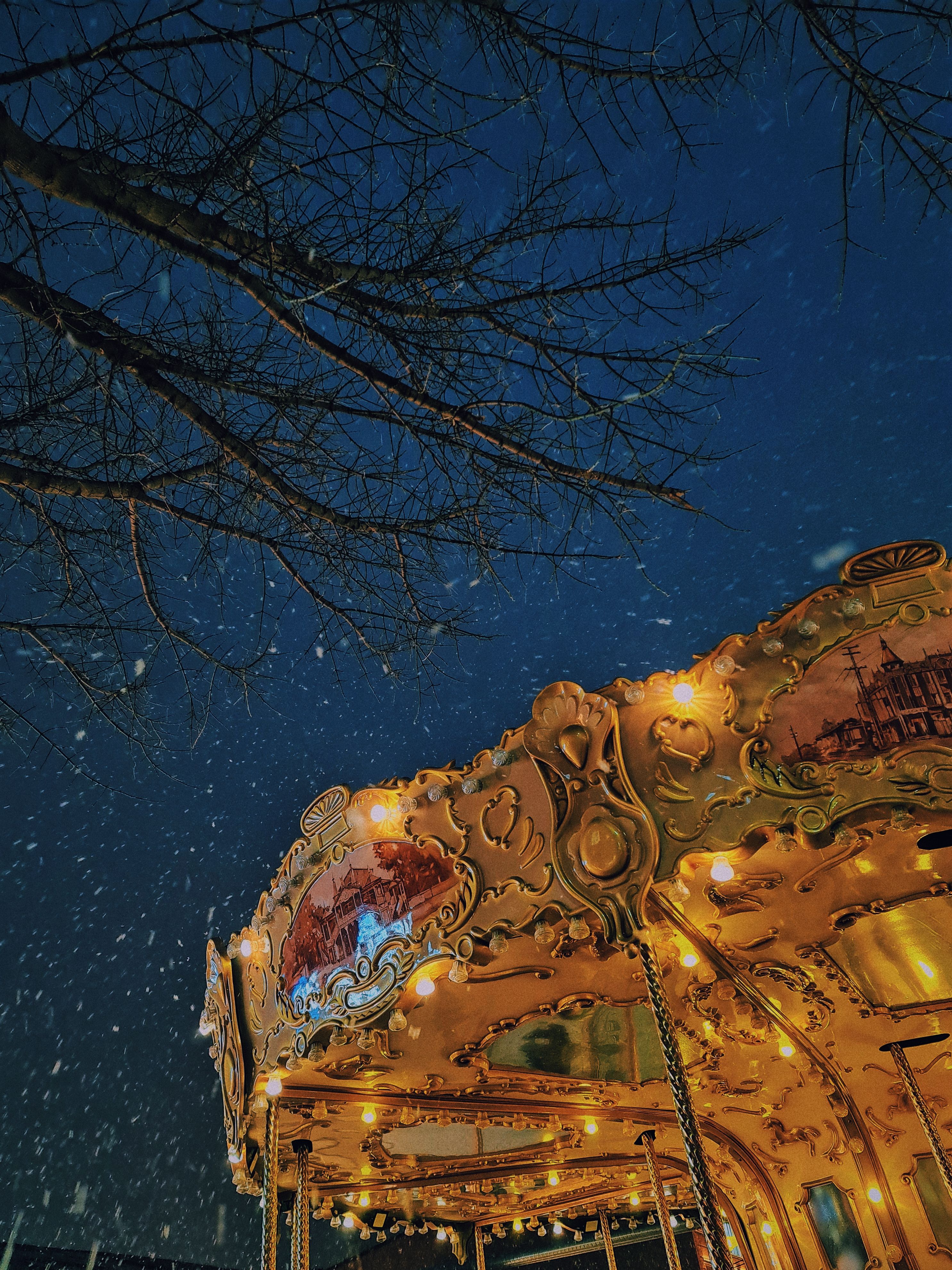 Low Angle Shot of Carousel Against Night Sky · Free Stock Photo