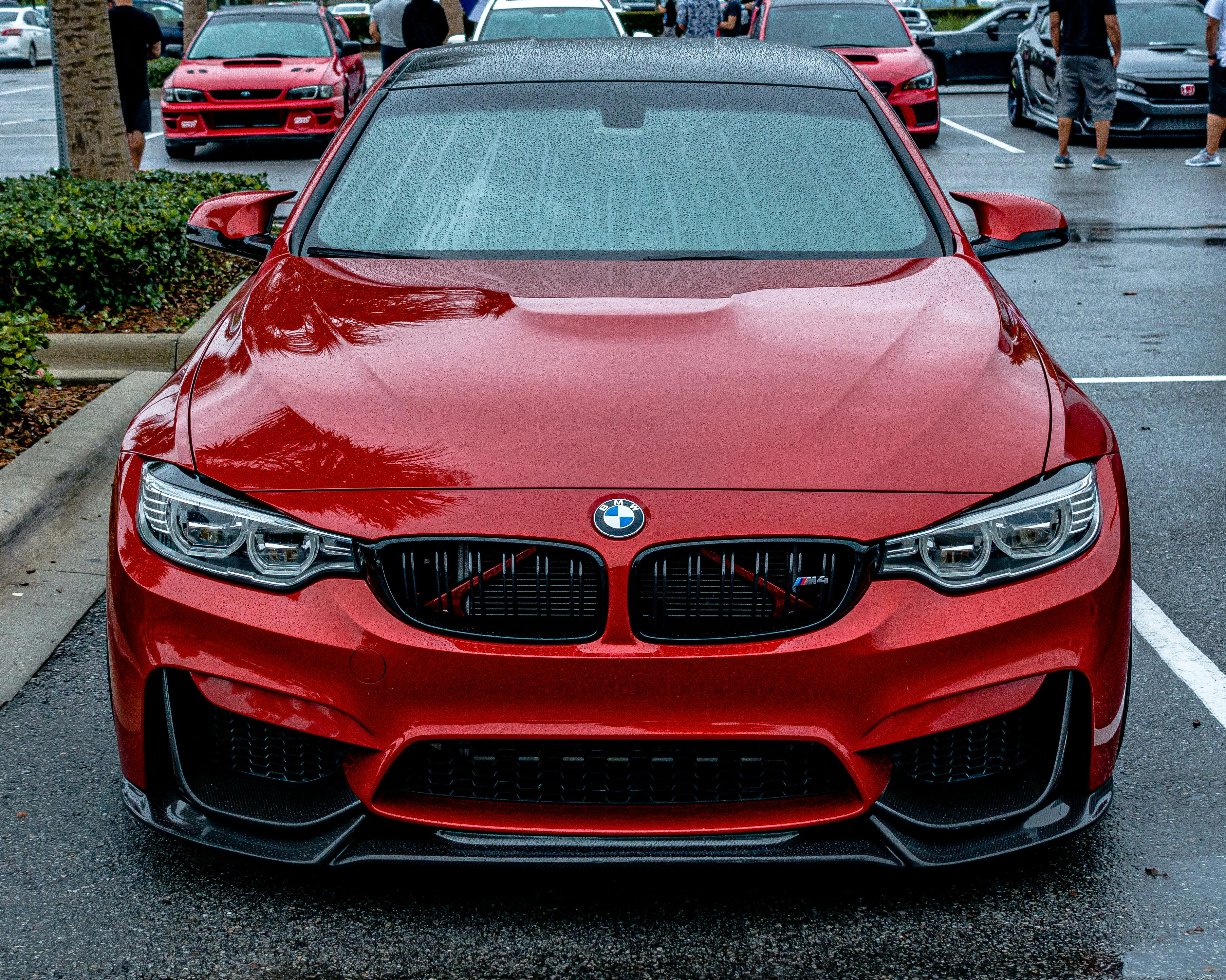 A Red Bmw Car Parked on a Parking Lot · Free Stock Photo