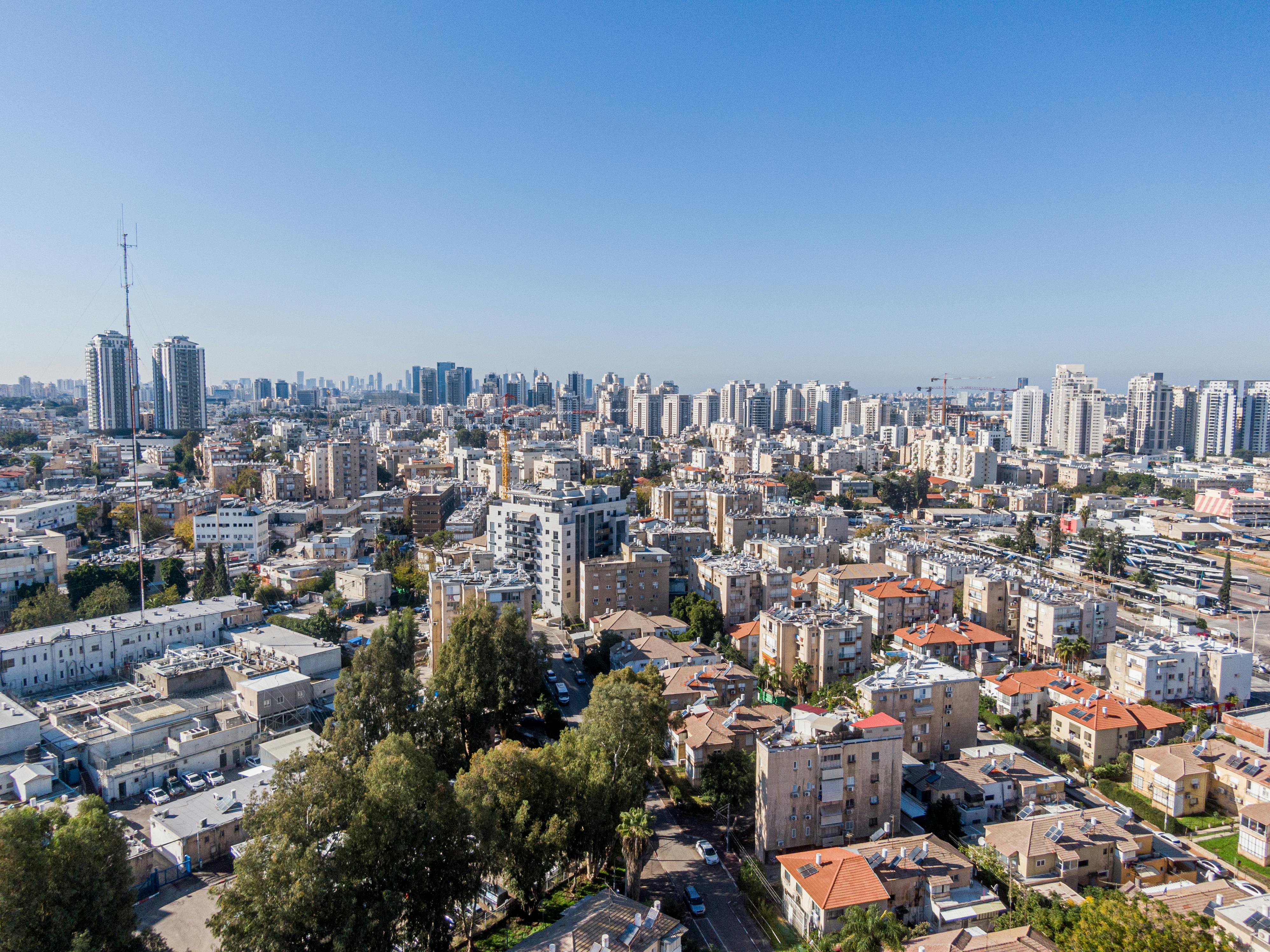 Aerial Photography of High Rise Buildings Under Blue Sky · Free Stock Photo