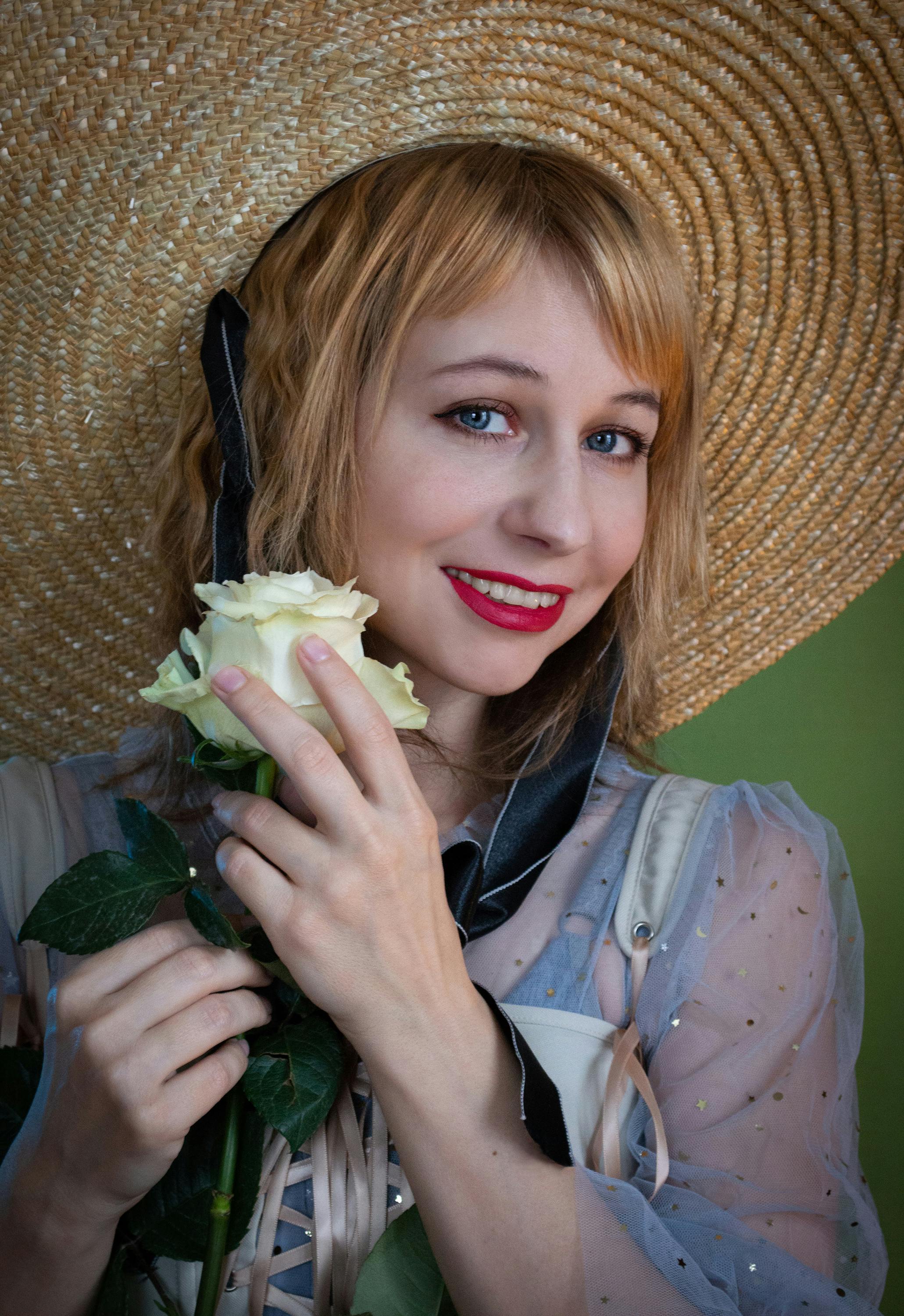 Beautiful Woman Biting a Flower · Free Stock Photo