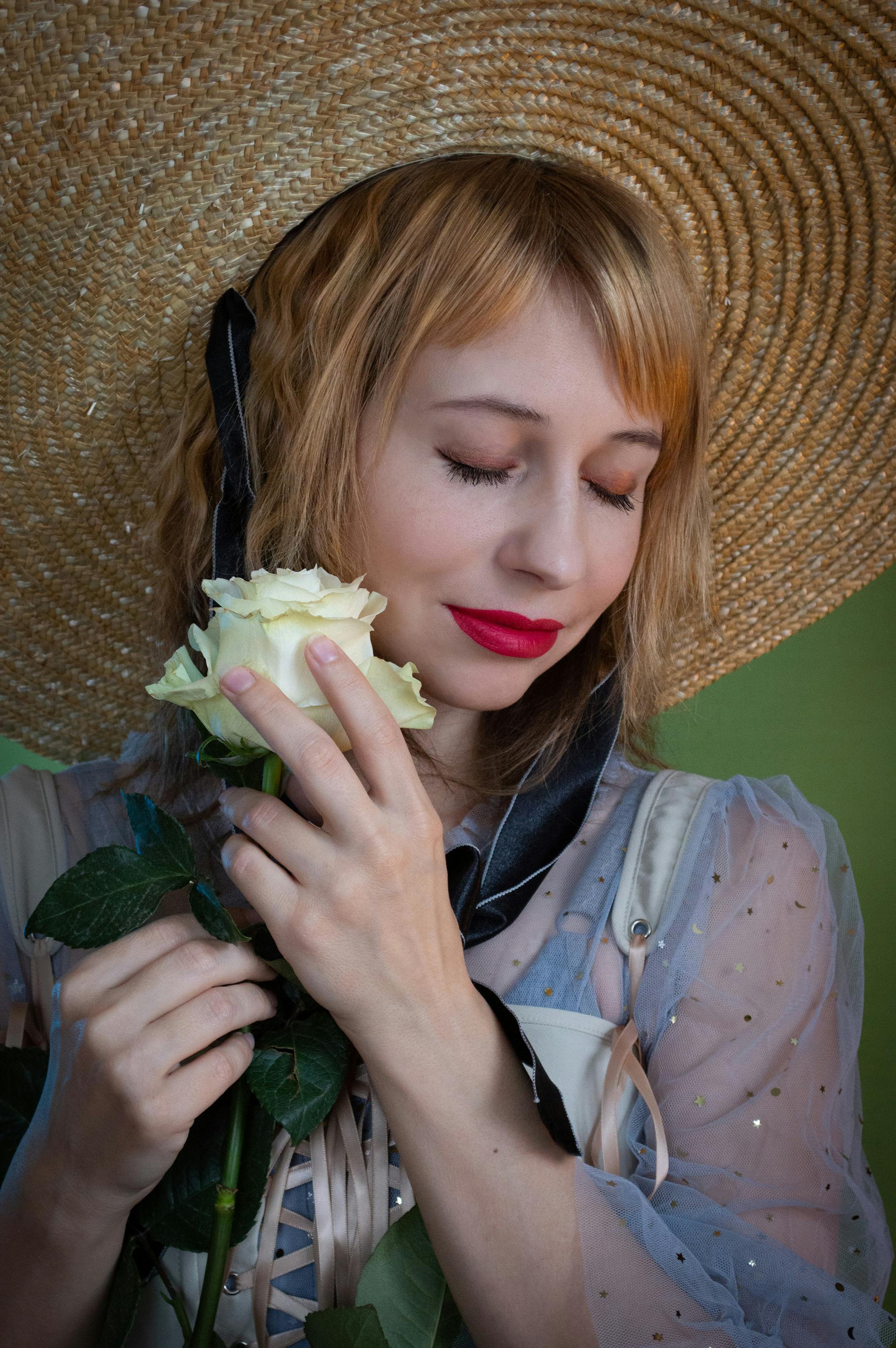 Beautiful Woman in Traditional Clothes Holding Bougainvillea Flowers ...