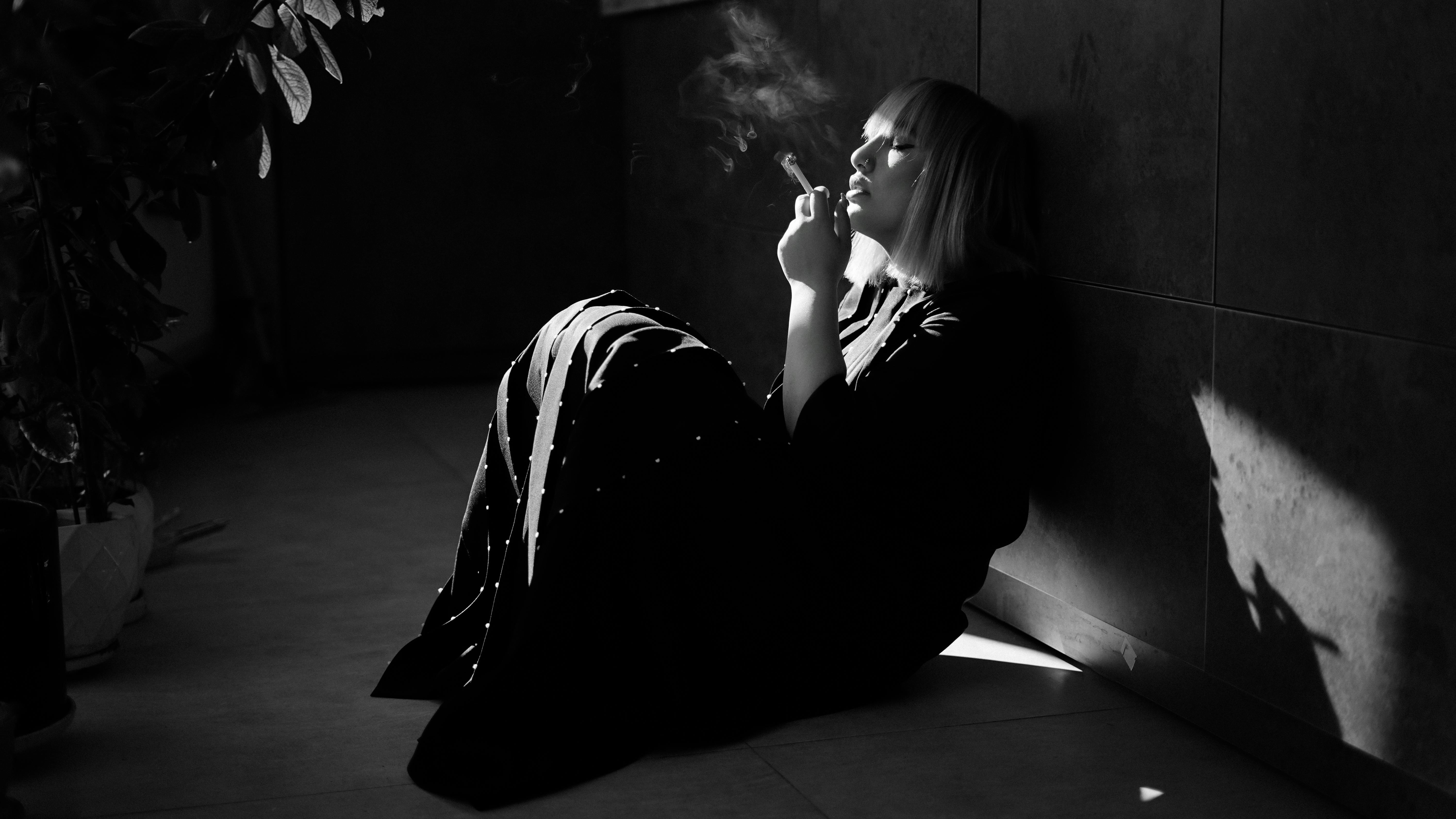 Woman Wearing a Dress Sitting on the Floor Smoking Cigarette · Free ...