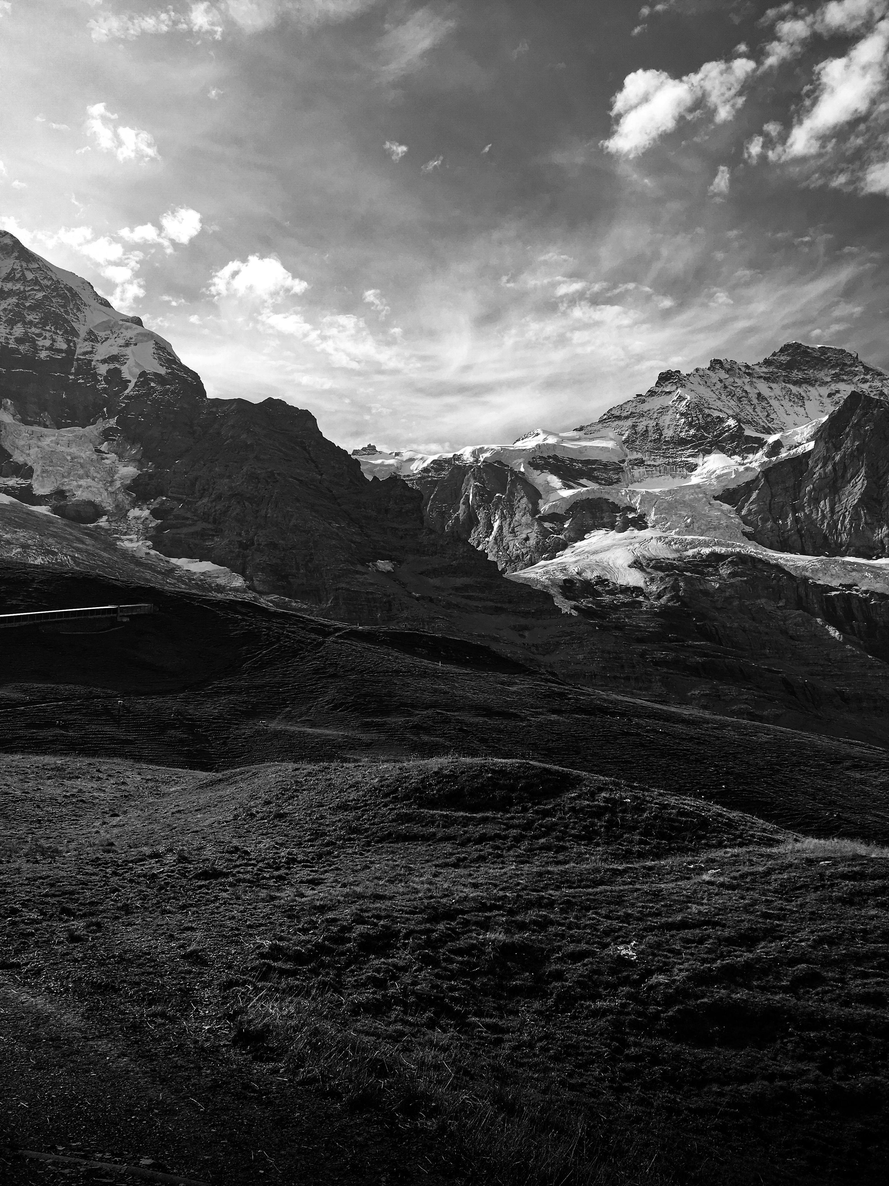 Grayscale Photo of Snow Capped Mountains · Free Stock Photo