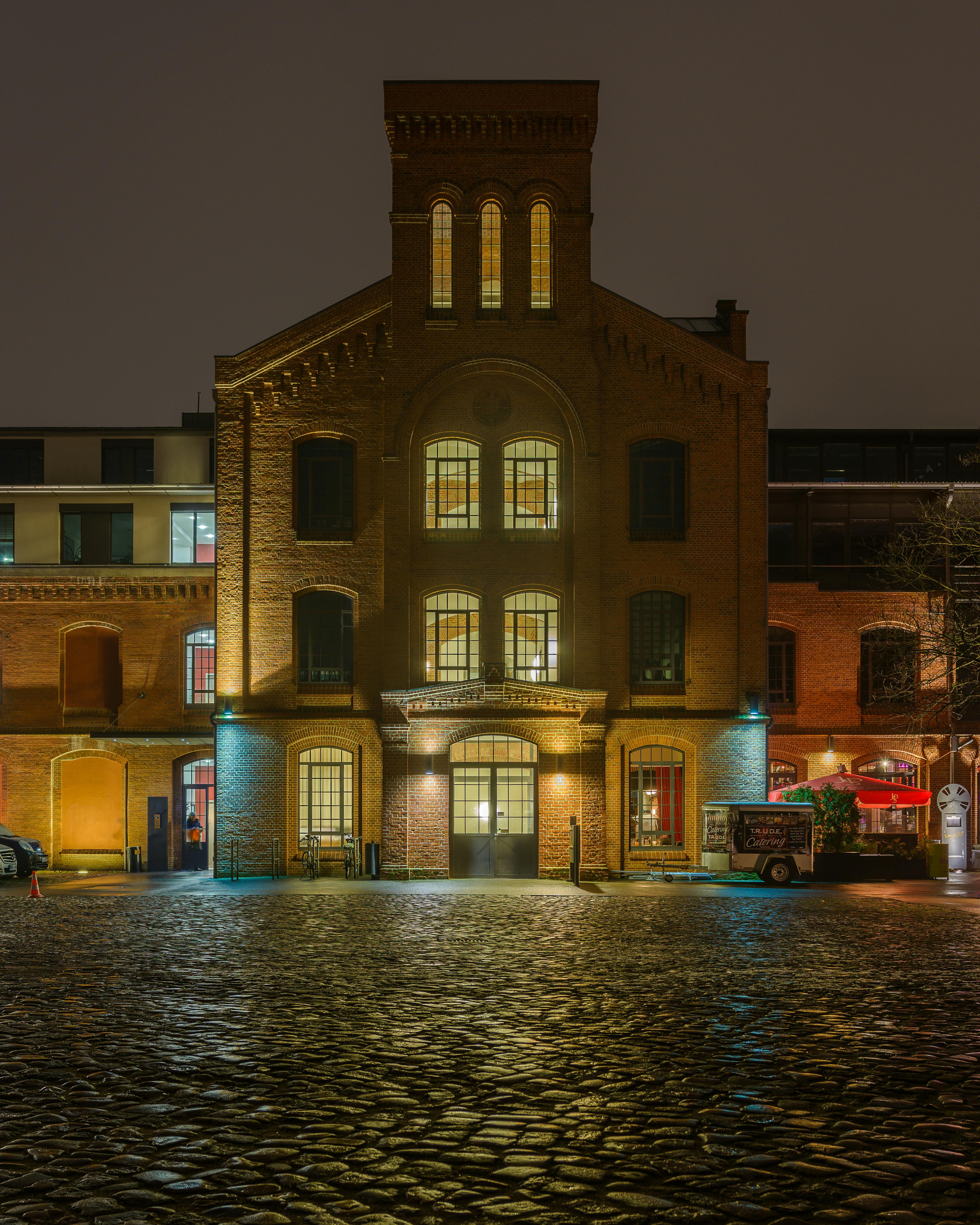 A Concrete Building at Night · Free Stock Photo