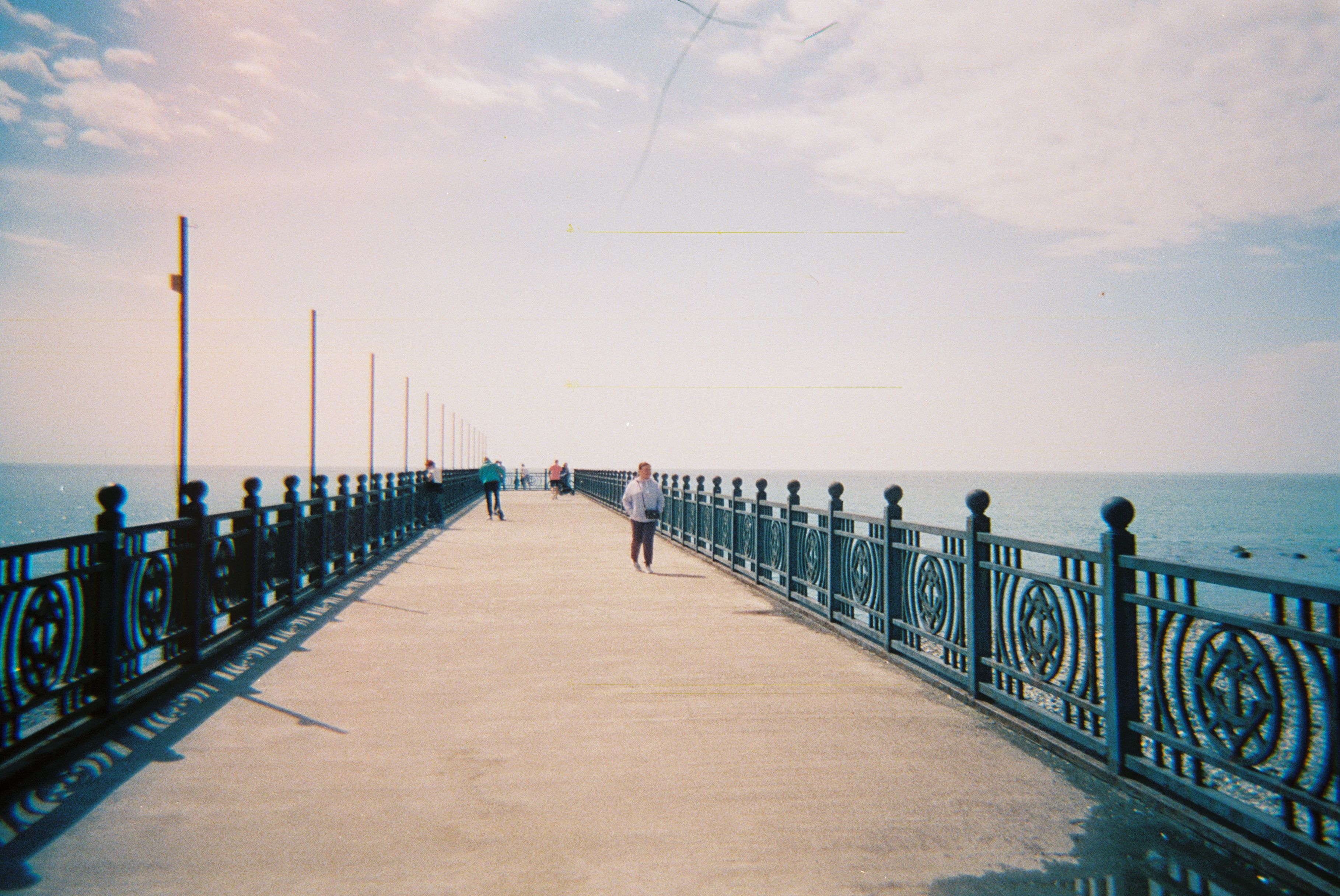 A Person Crossing a Bridge · Free Stock Photo