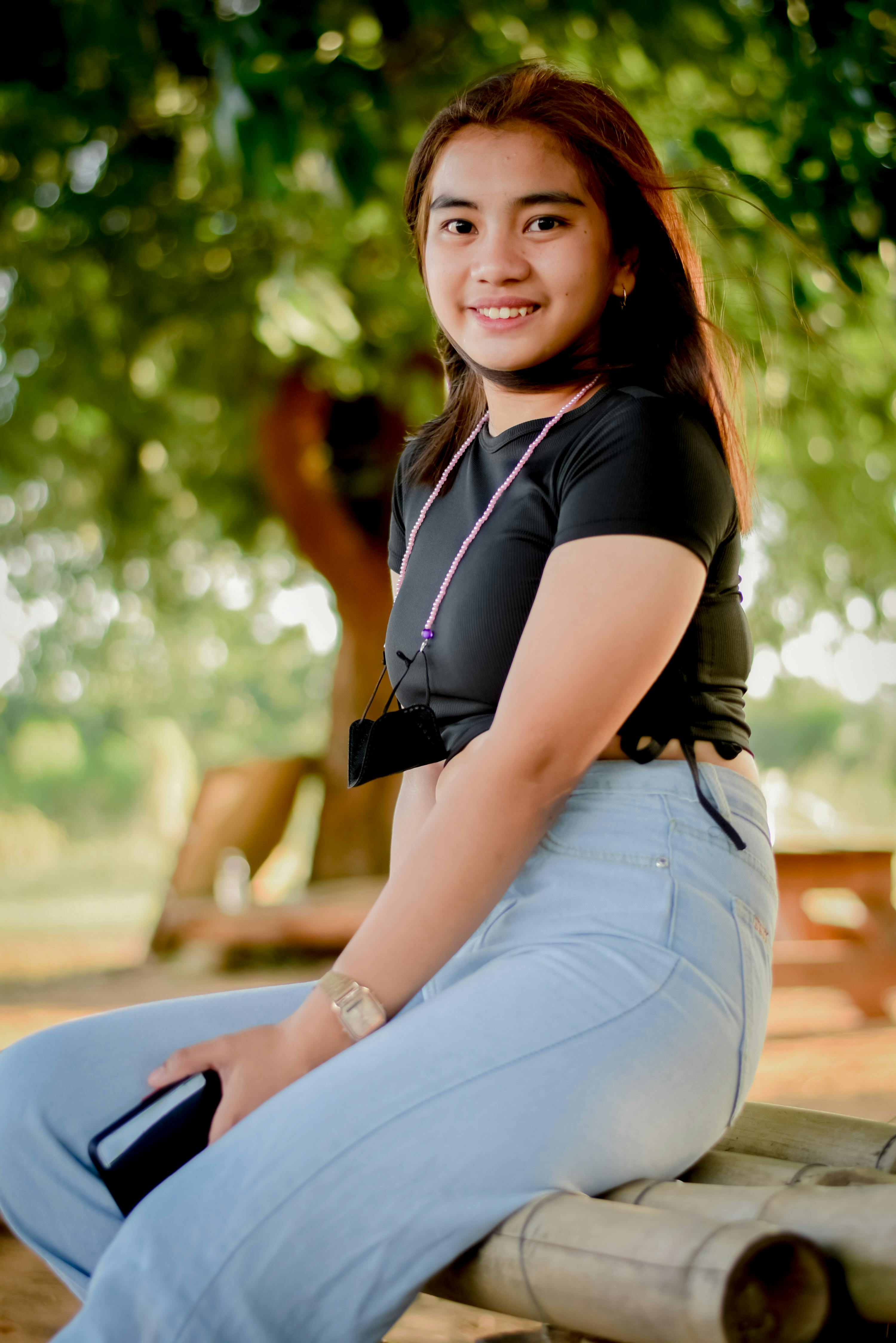 Teenage Girl Standing on Grass · Free Stock Photo