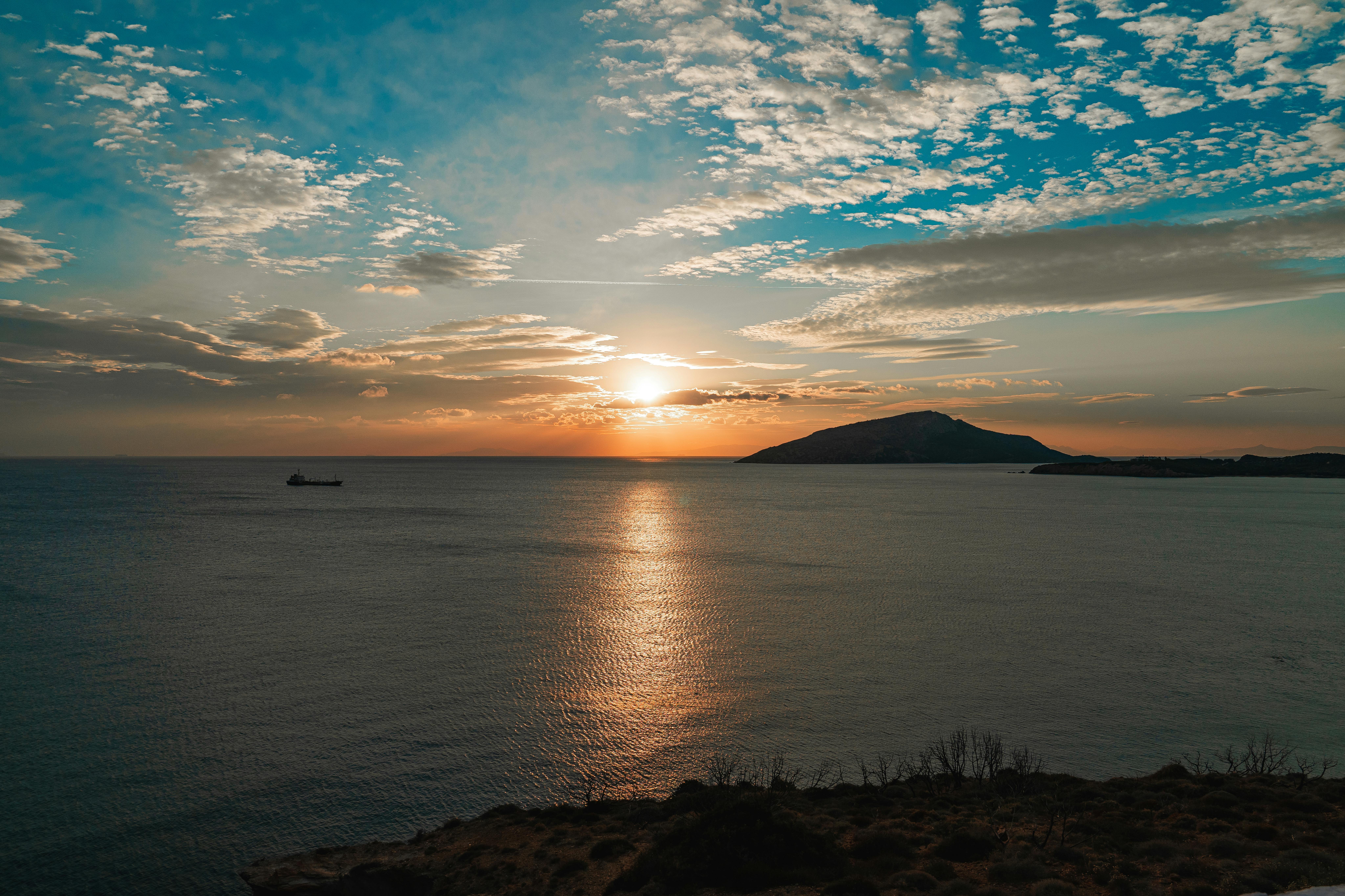 Scenic View of an Ocean During Golden Hour · Free Stock Photo