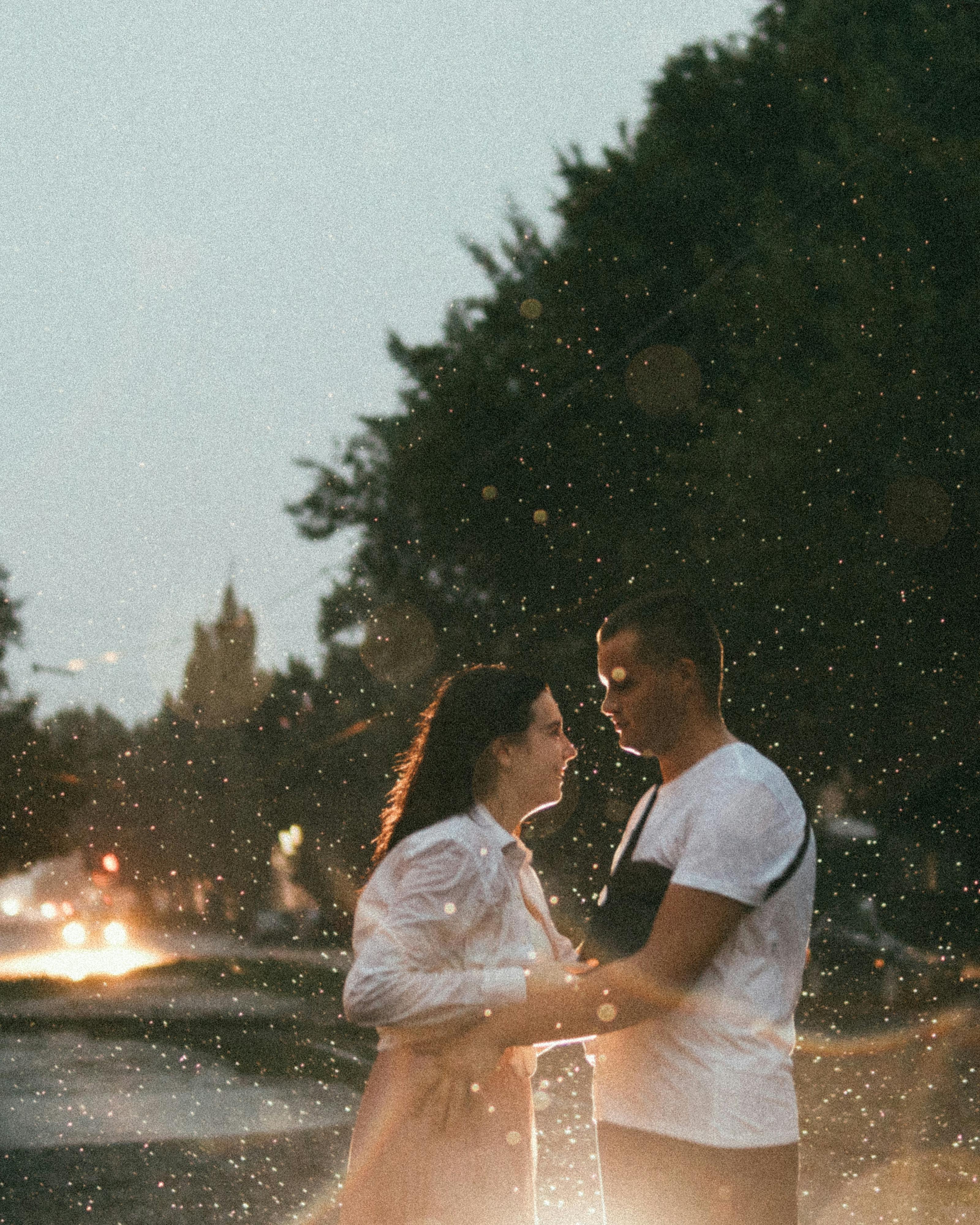Water Drops over Hugging Couple · Free Stock Photo