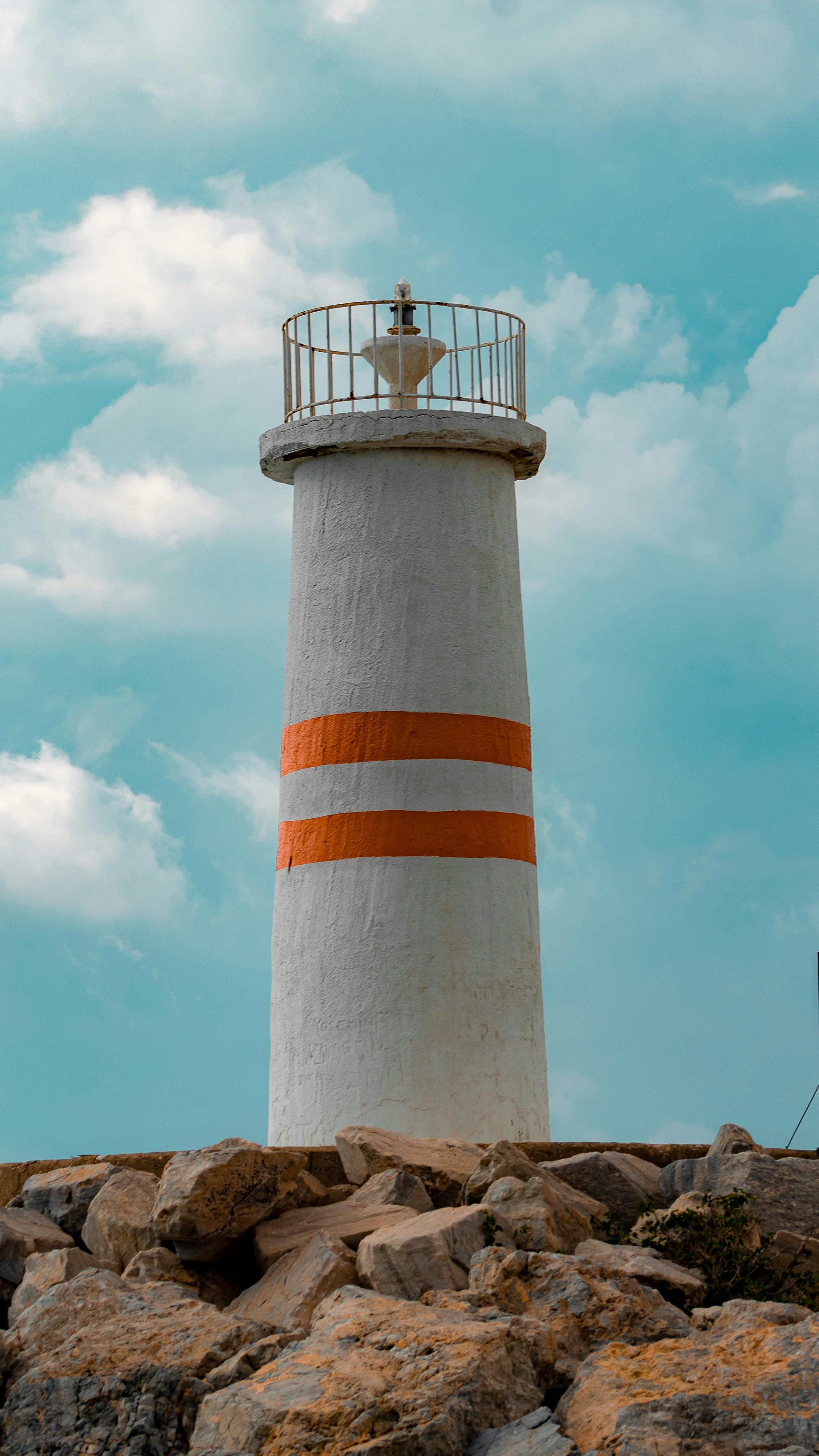 A Lighthouse Against the Blue Sky · Free Stock Photo