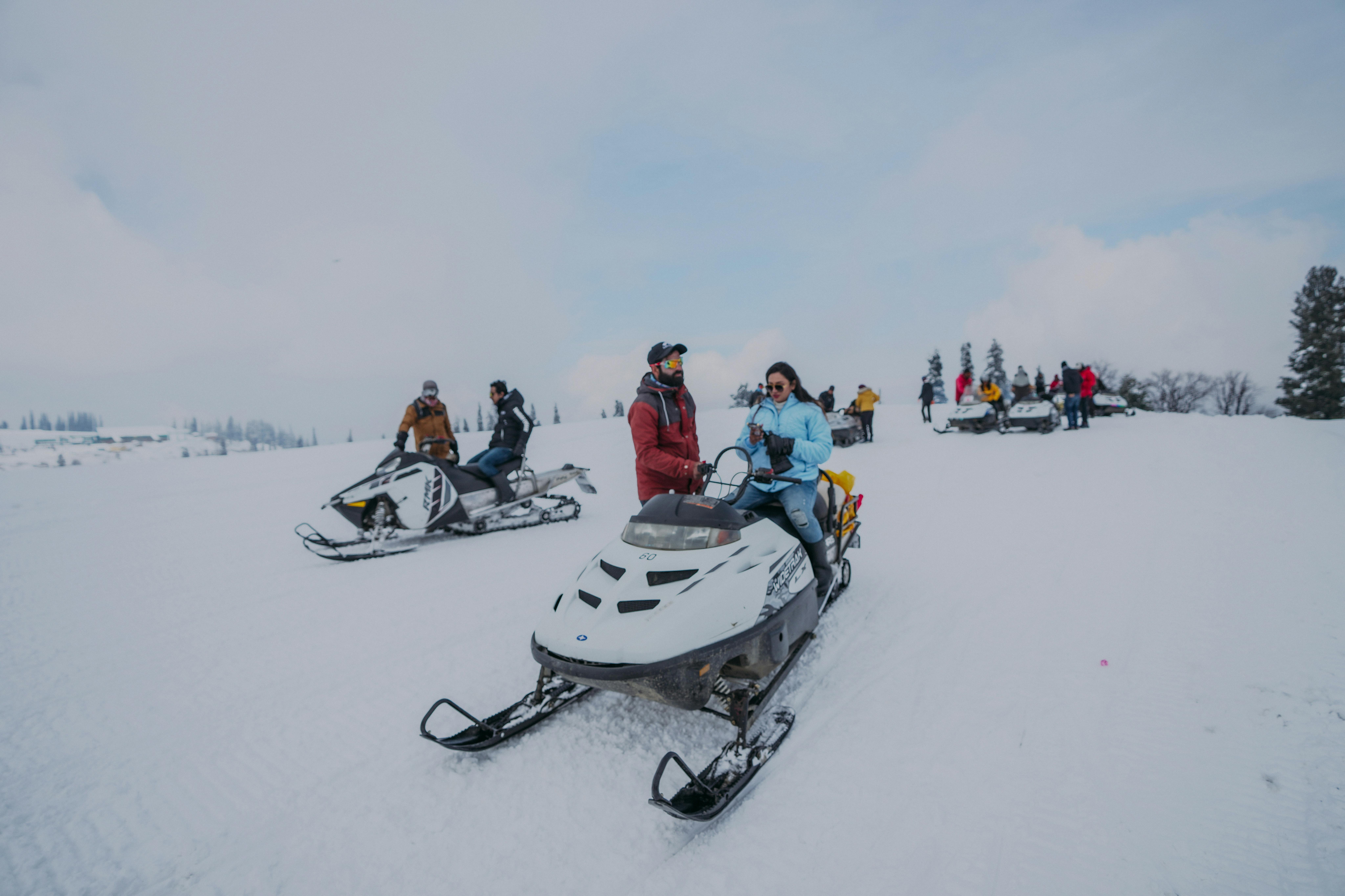 People Riding Snowmobiles · Free Stock Photo