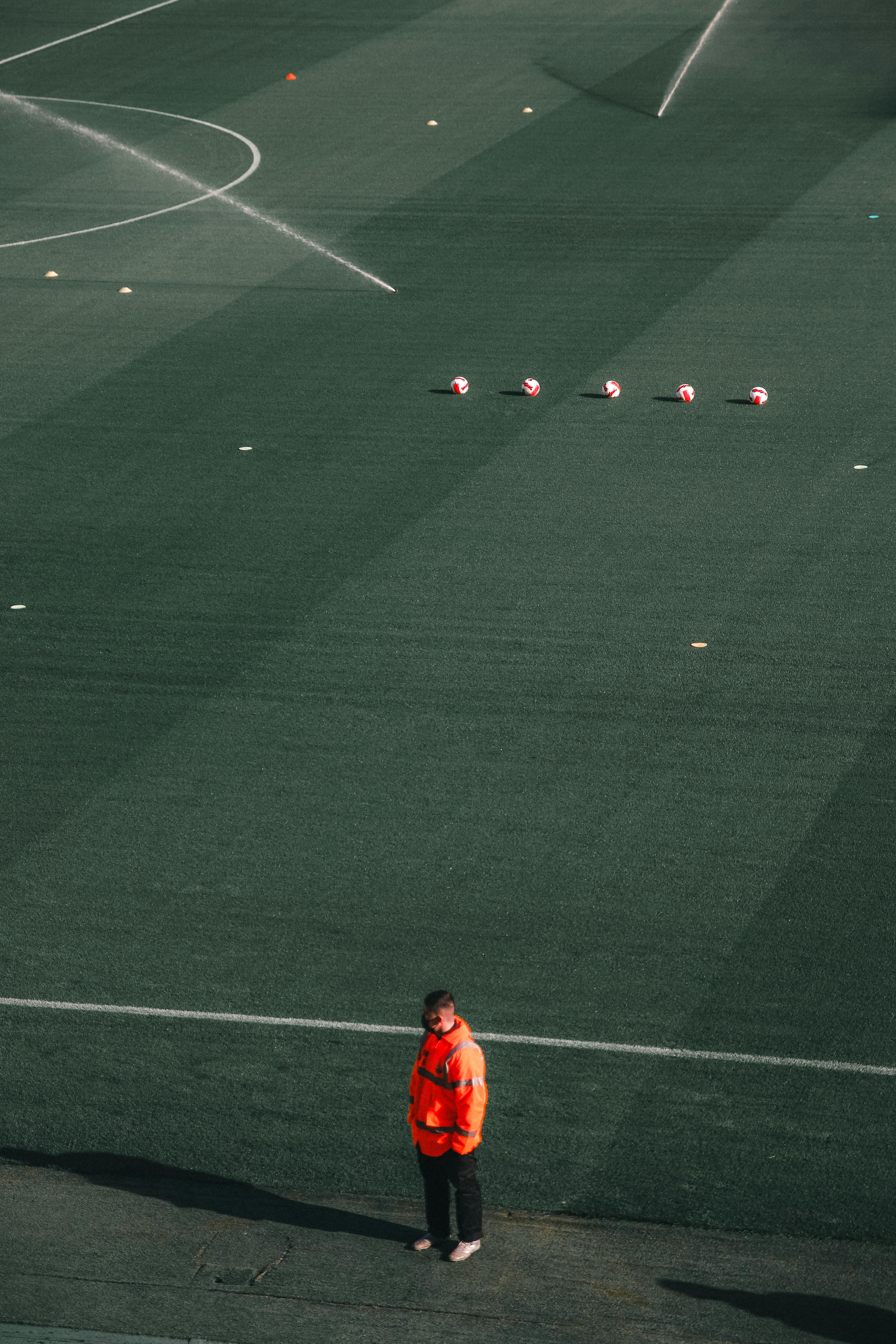 Man Standing on Football Field · Free Stock Photo