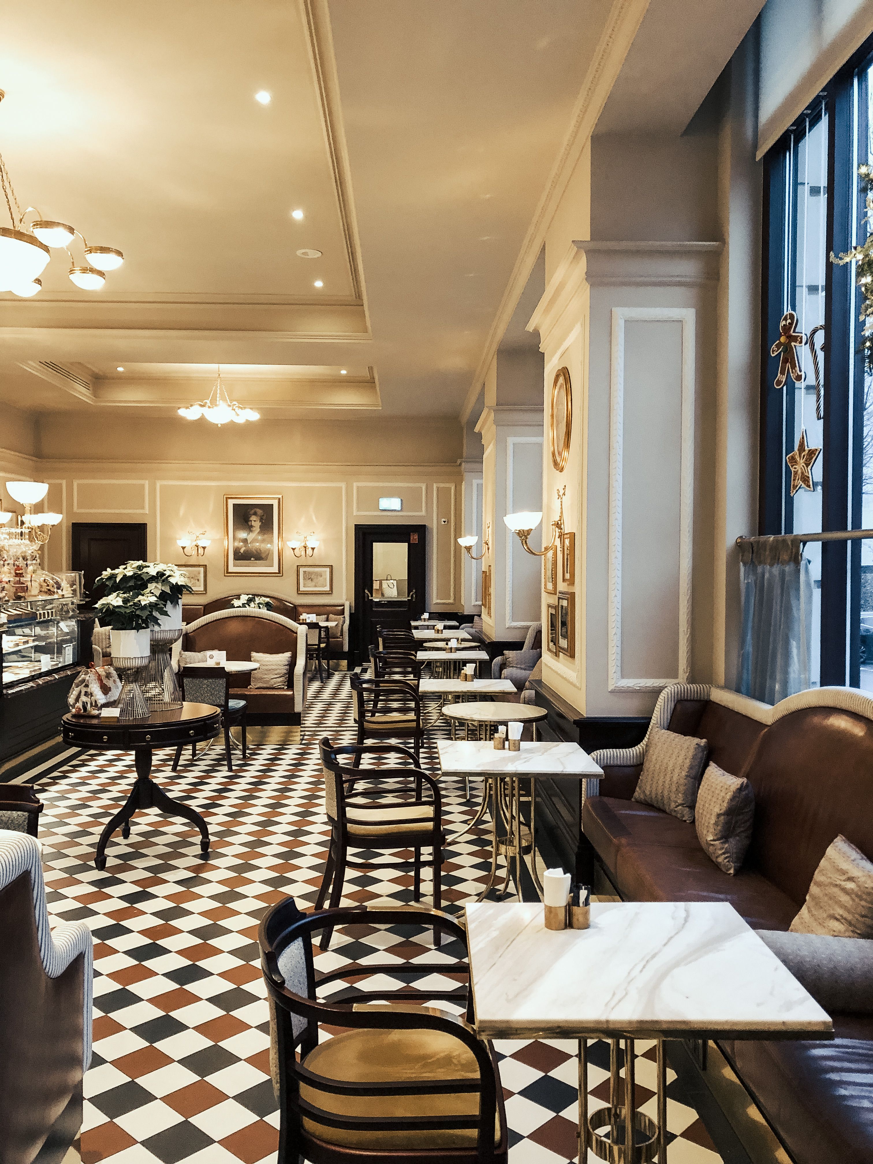 Interior Design of an Elegant Cafe with Sofas in Niches · Free Stock Photo