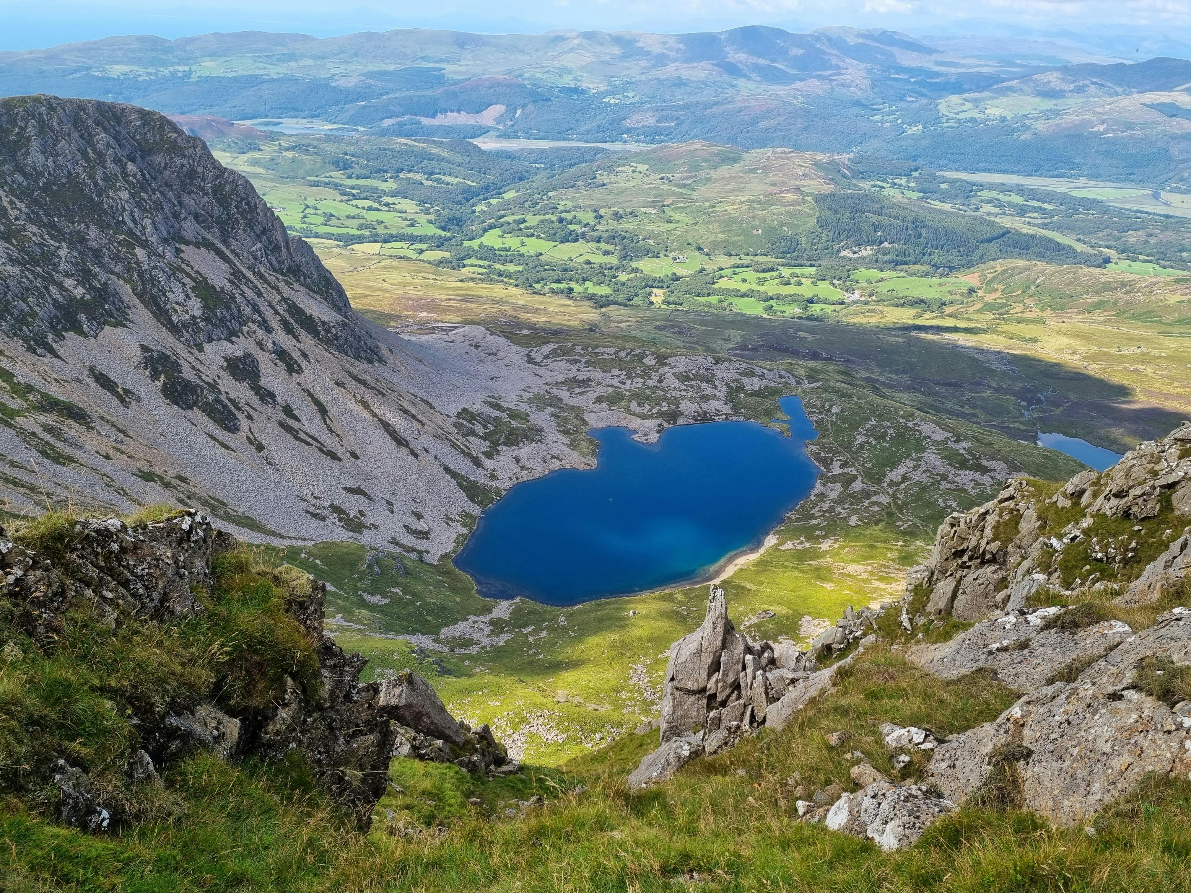 An Aerial Photography of a Lake Between Mountains · Free Stock Photo