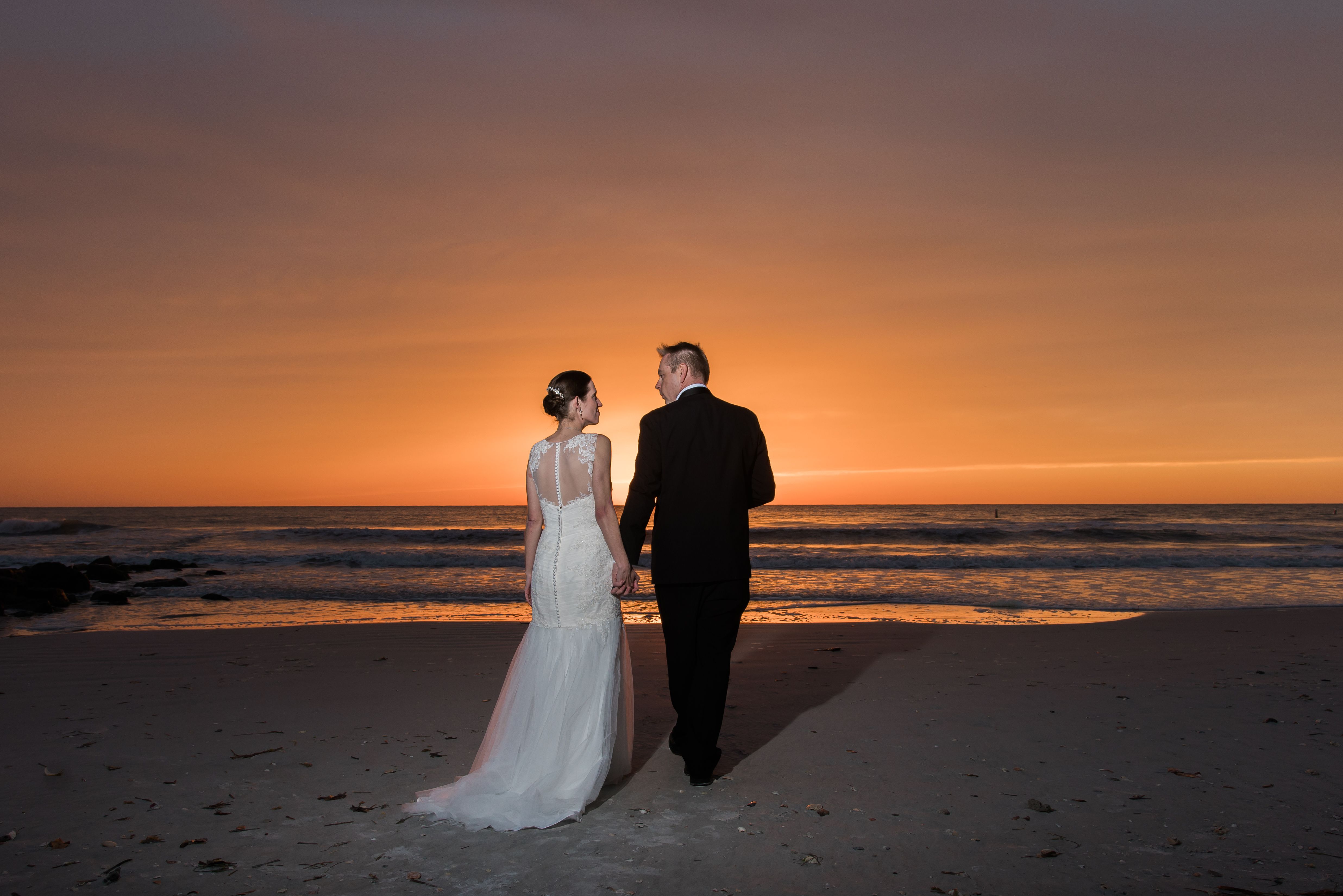 Silhouette of a Couple on the Beach at Sunset · Free Stock Photo