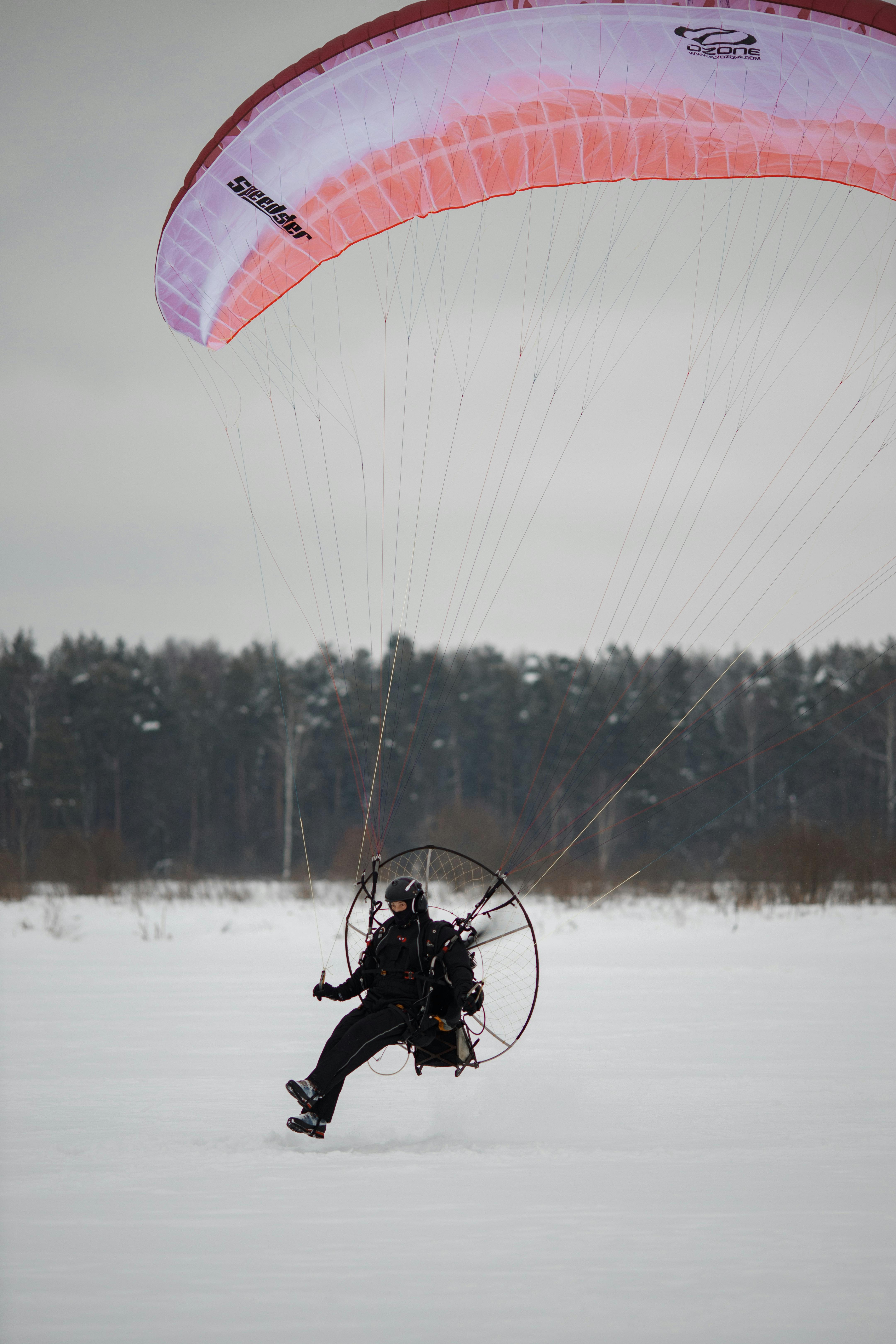 Person Skydiving with a Yellow Parachute · Free Stock Photo