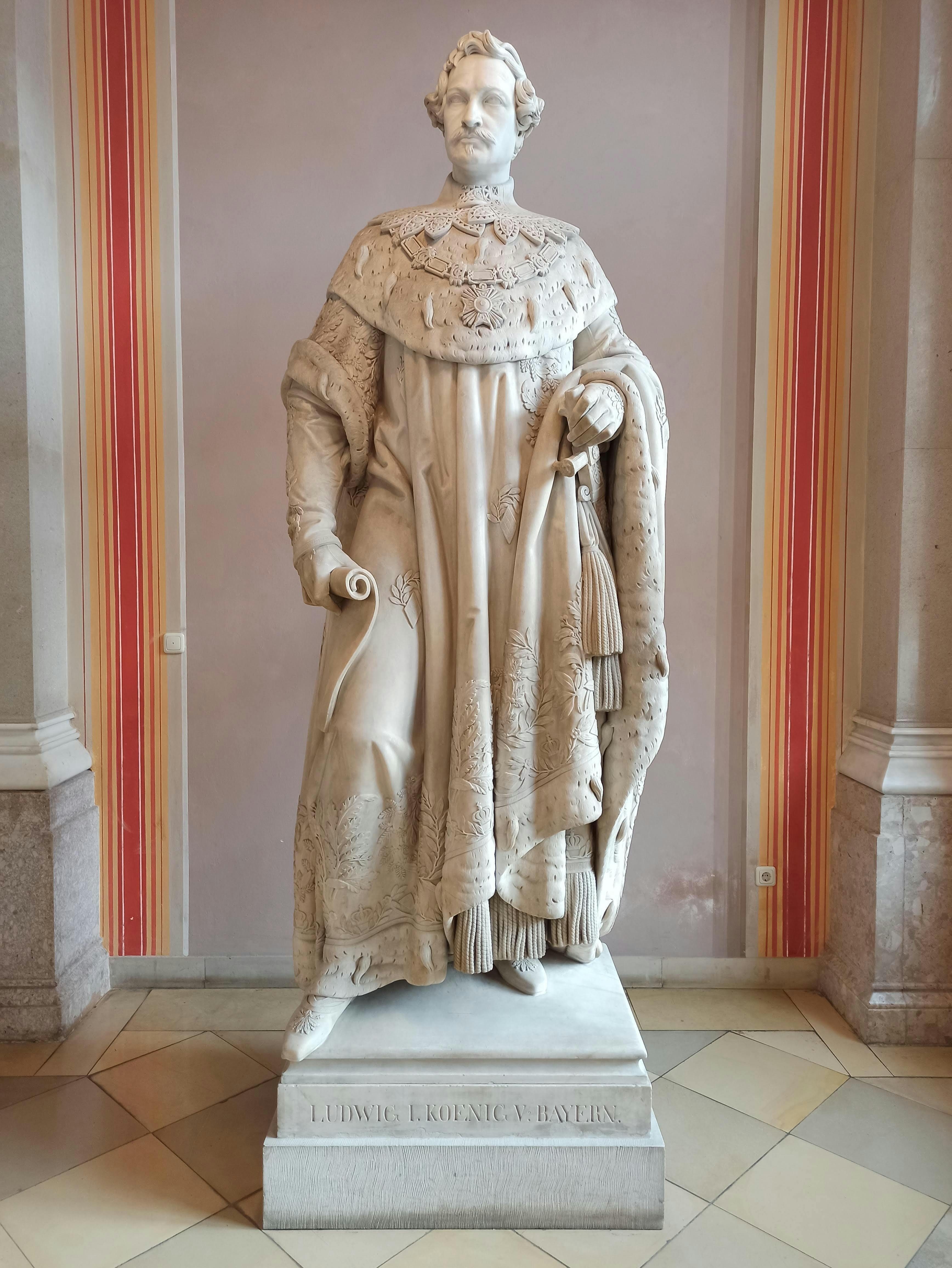 Man in Robe Statue on Tiled Floor · Free Stock Photo