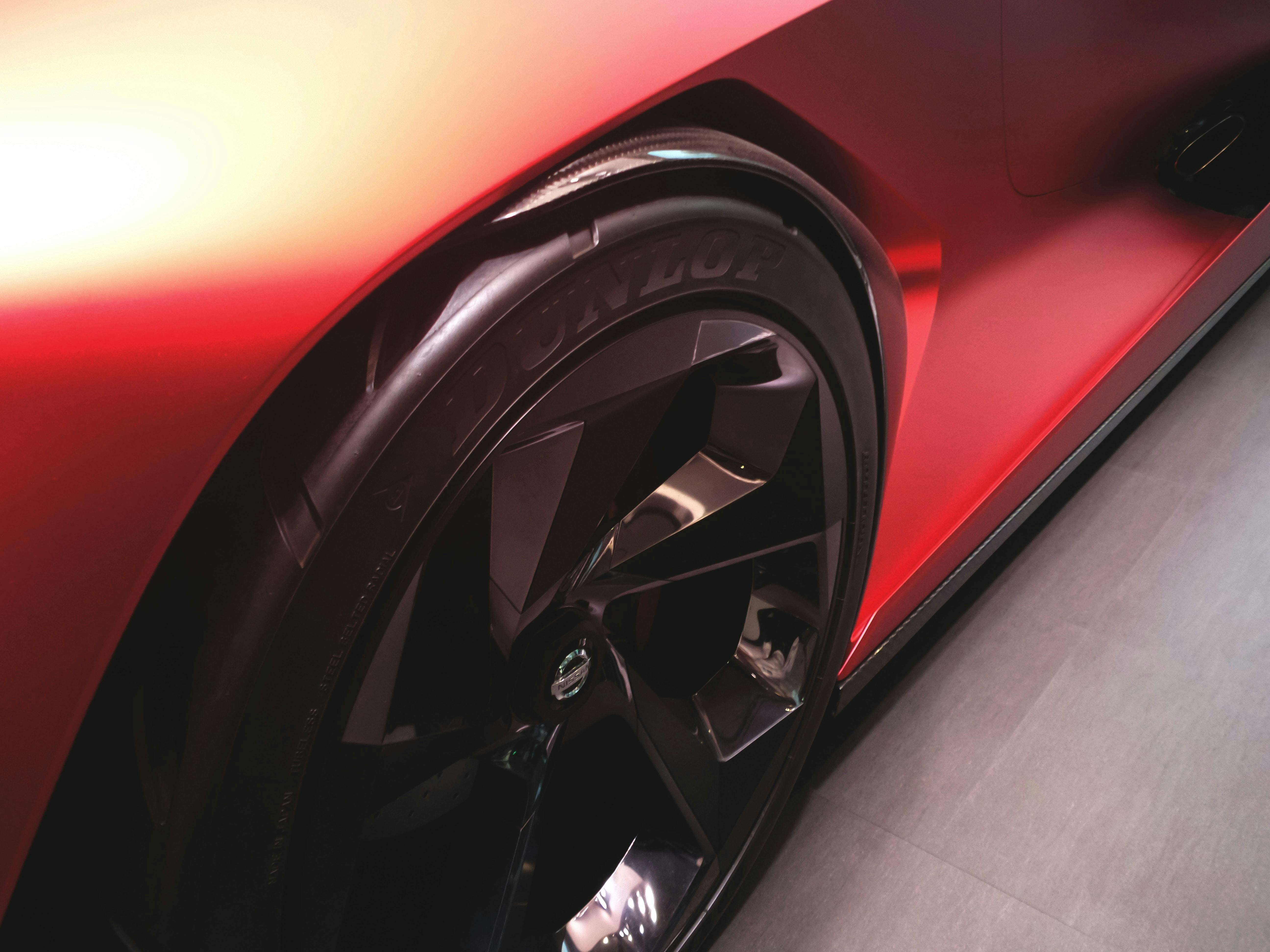 Close-Up Photo of a Luxury Car's Rim · Free Stock Photo
