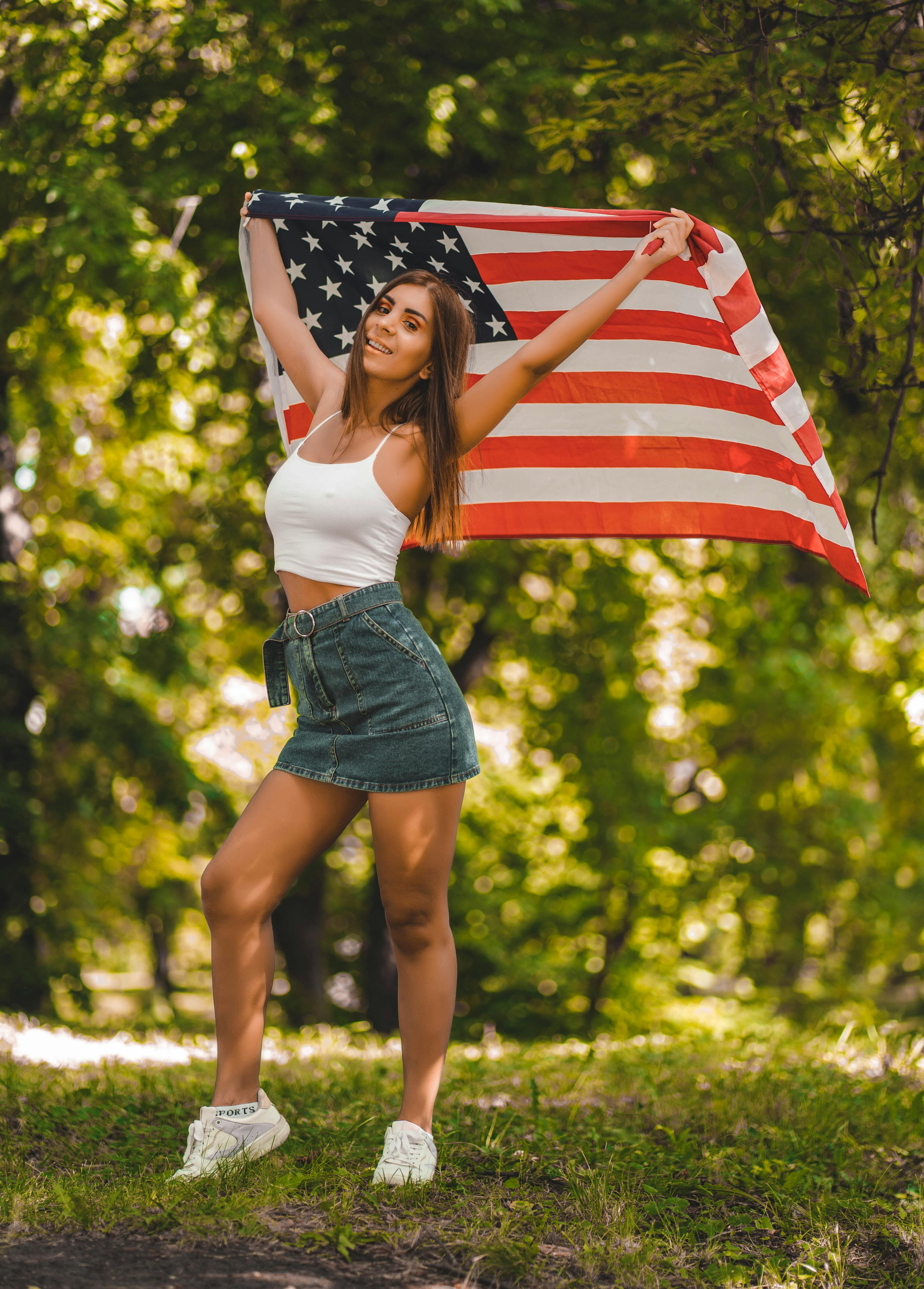 Woman Holding a Flag · Free Stock Photo