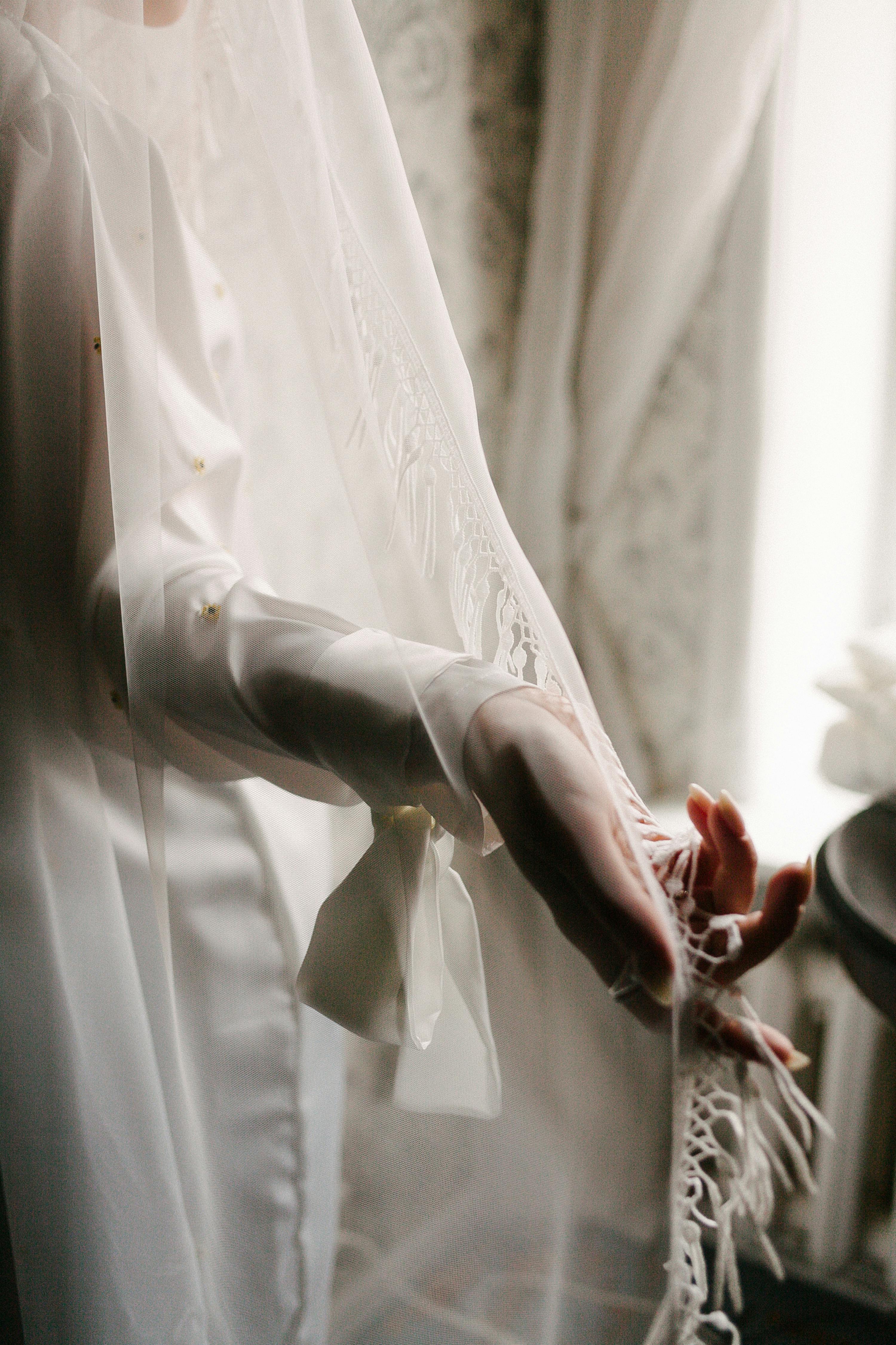 Hand under Wedding Veil · Free Stock Photo