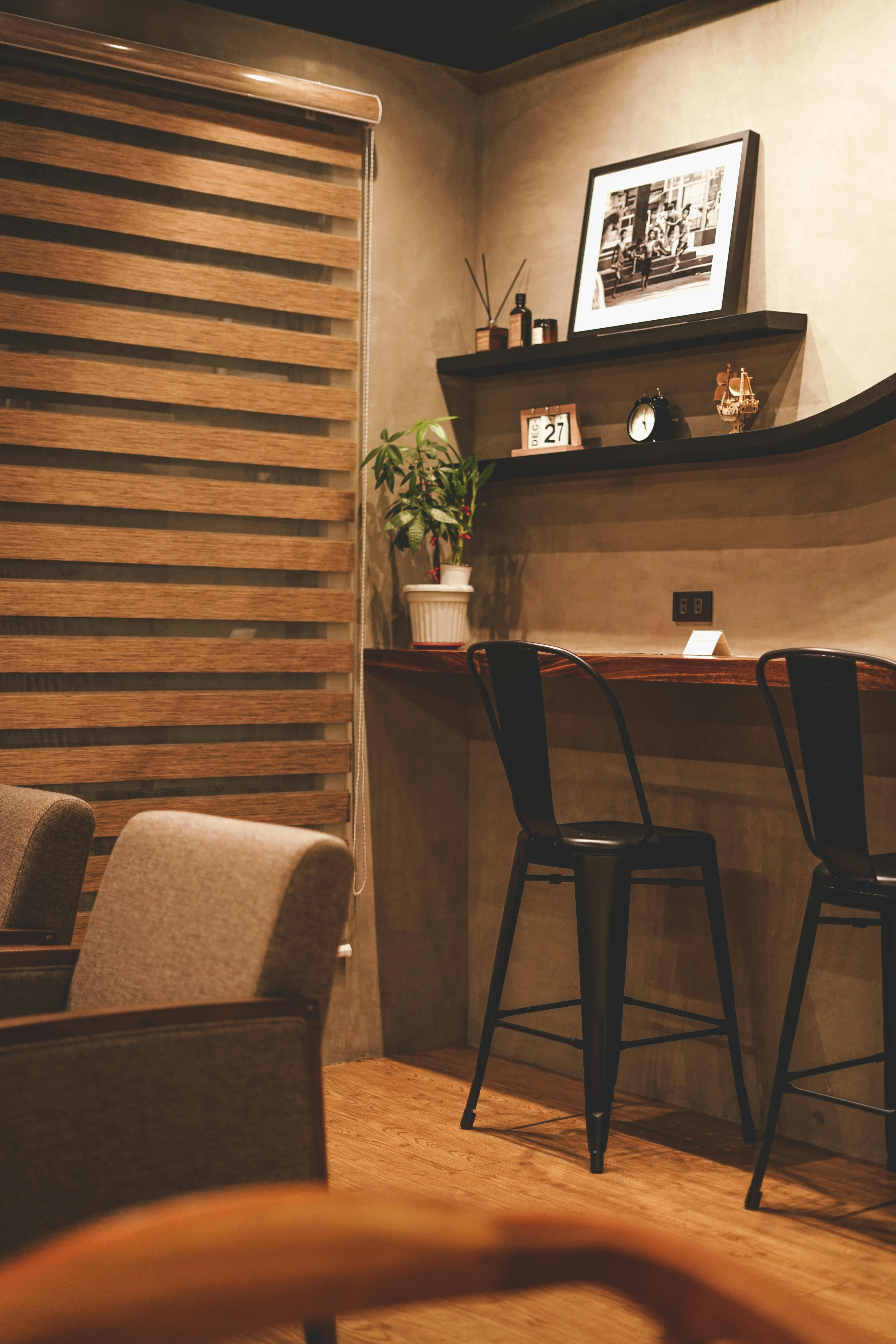 Black Chairs Beside Brown Wooden Table · Free Stock Photo