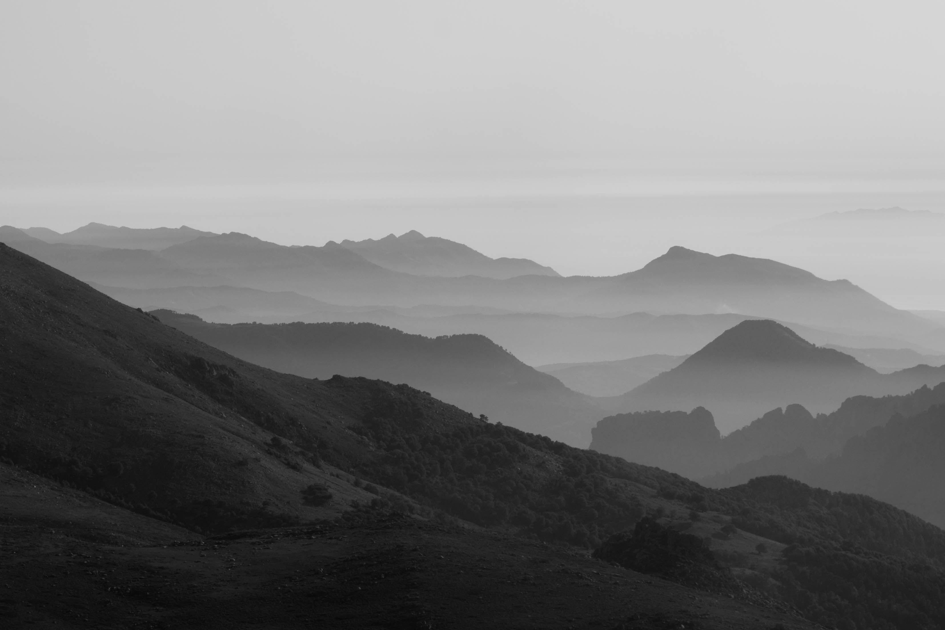 Landscape of Hills and Rocks in Black and White · Free Stock Photo