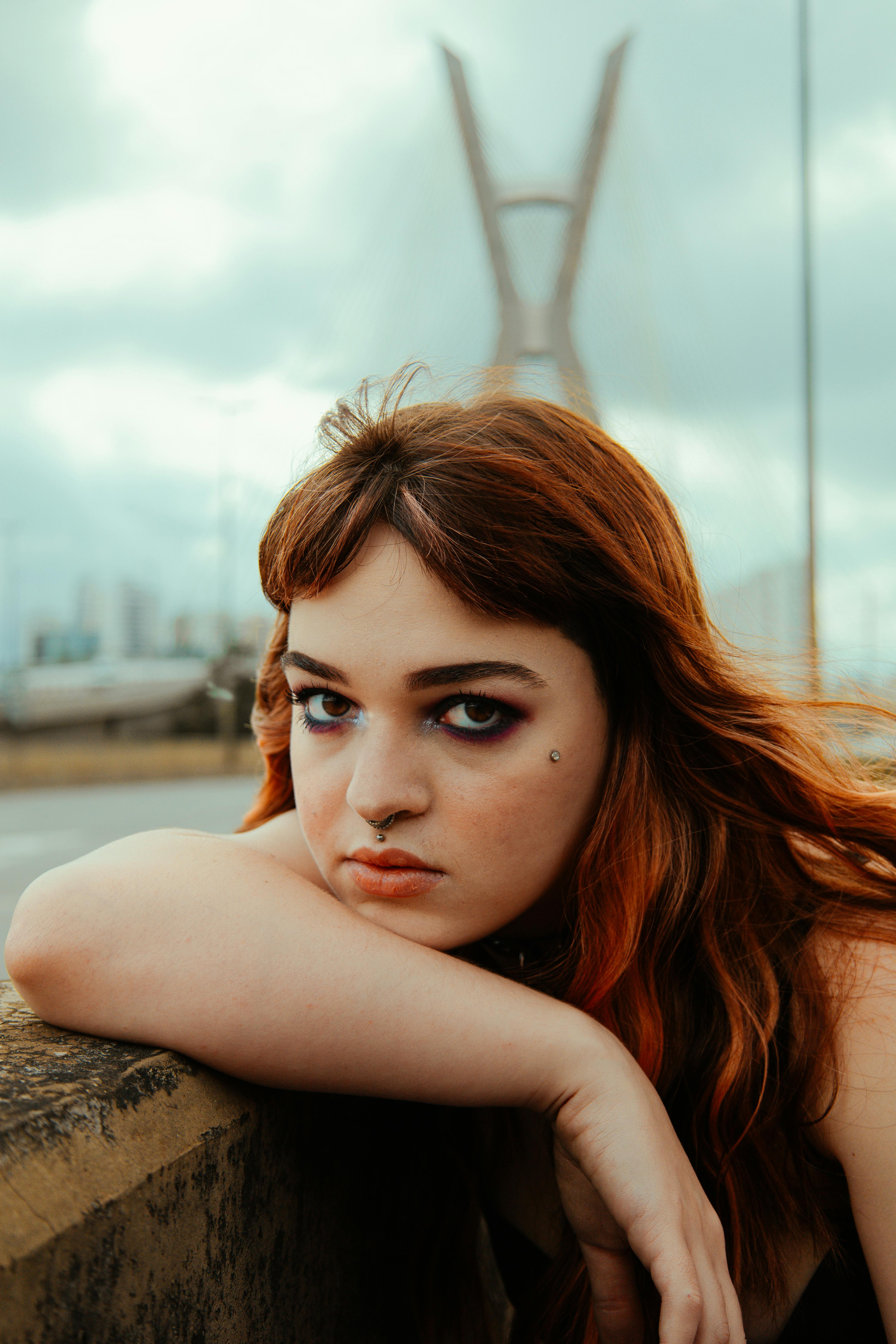 Girl Leaning on Balcony Railing · Free Stock Photo
