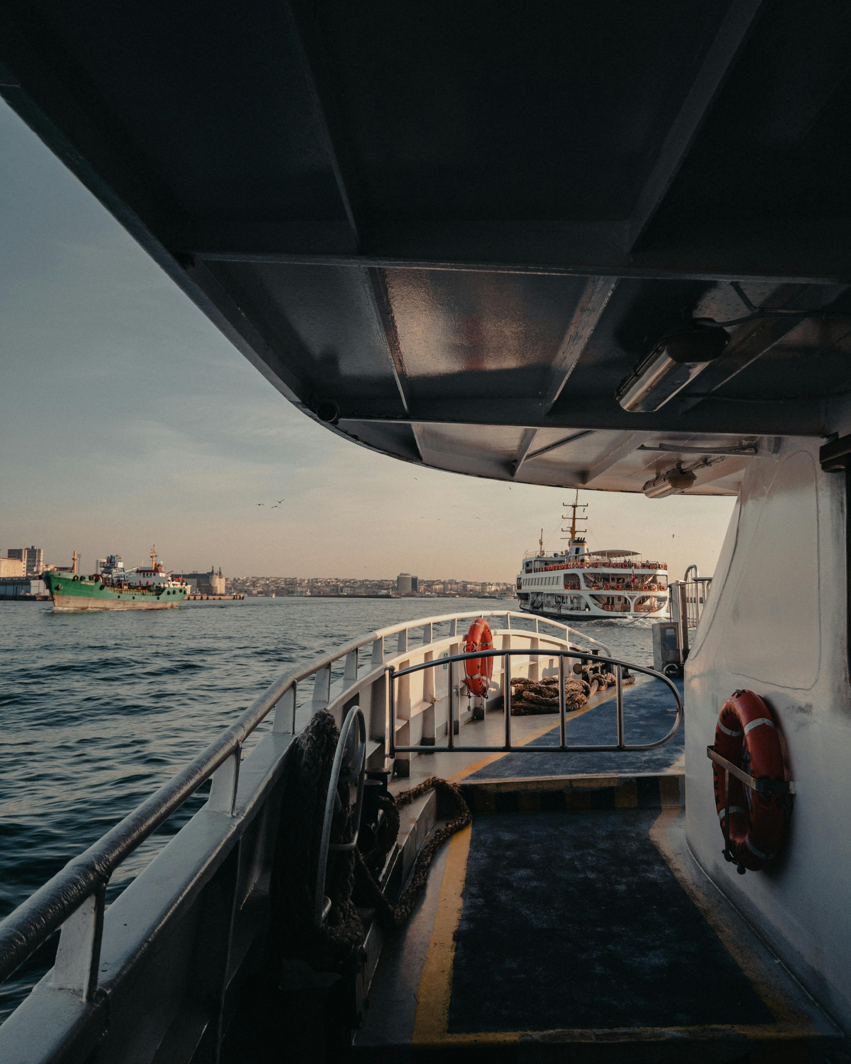 Ship Deck Overlooking Ferry Boat Sailing on Sea · Free Stock Photo