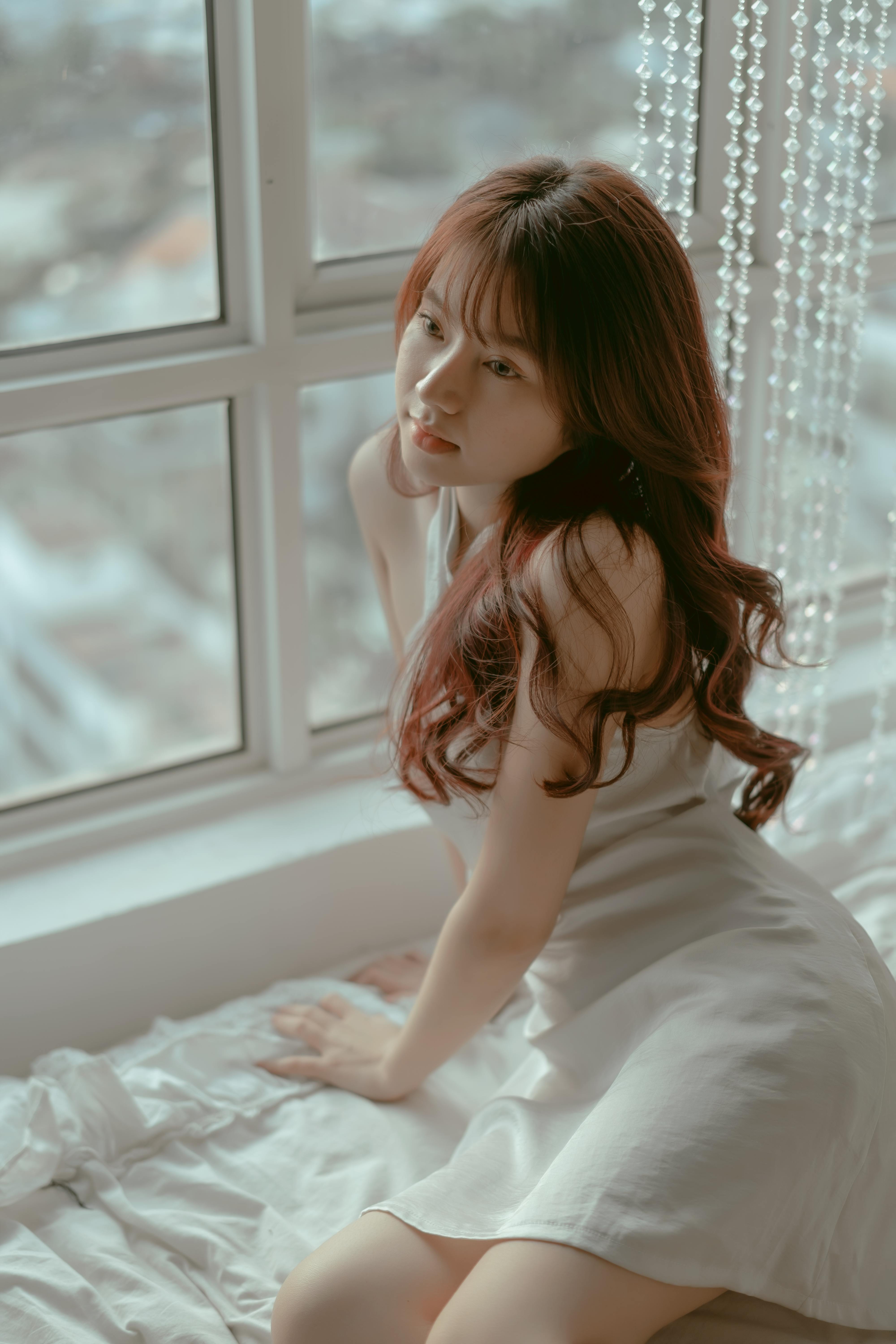 A Woman Wearing a White Dress · Free Stock Photo