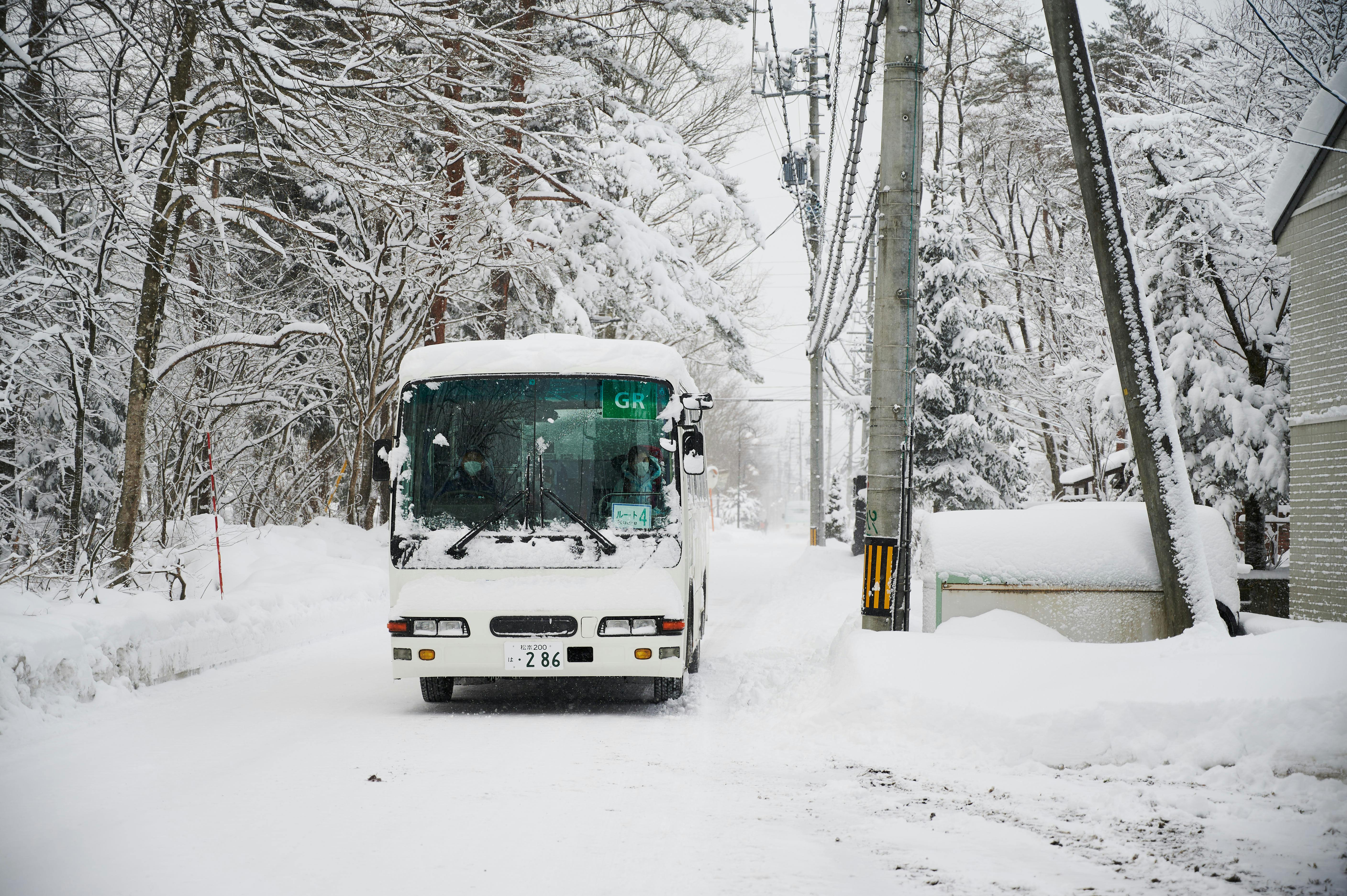 White Bus on a Snow Covered Road · Free Stock Photo