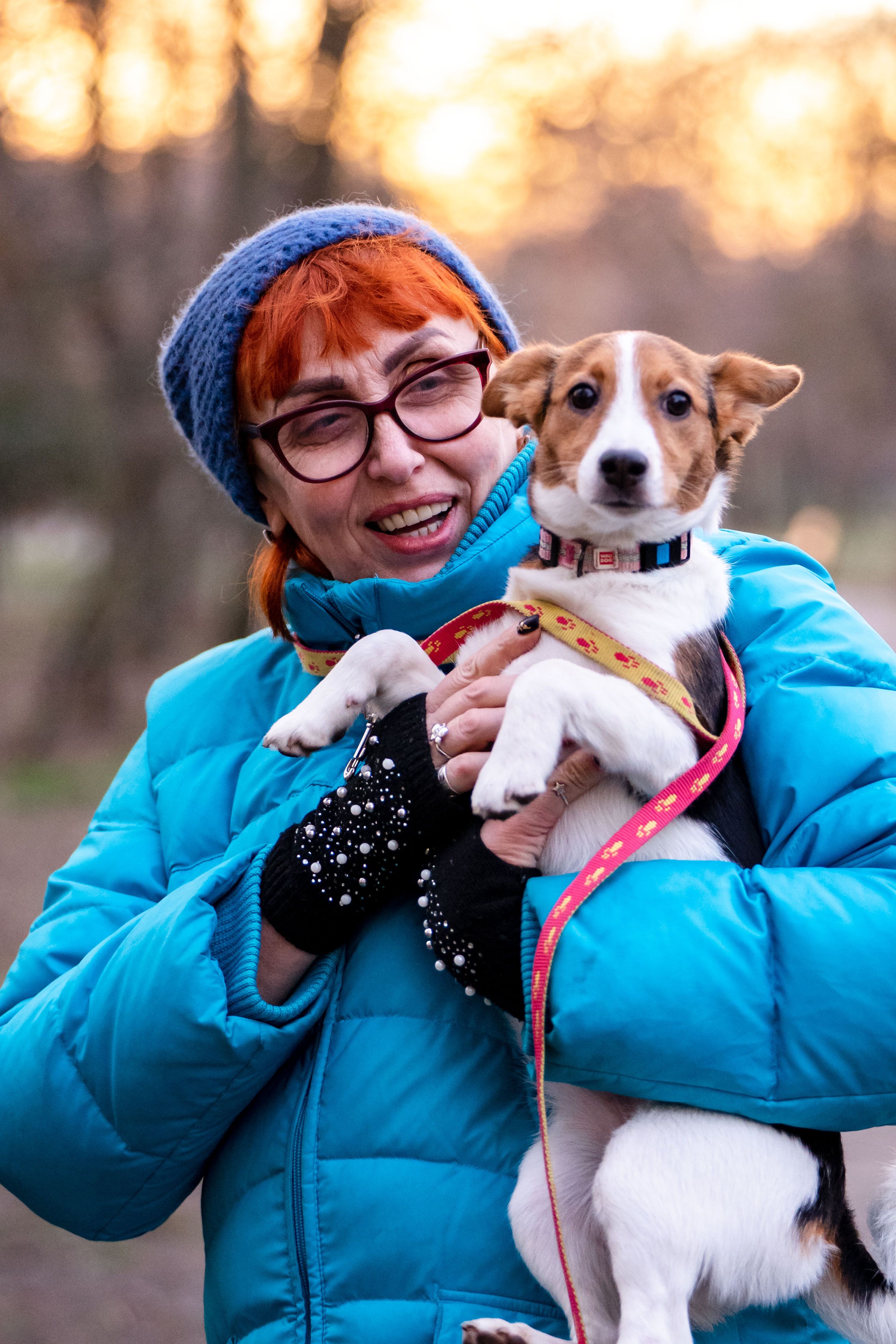 A Woman Carrying Her Dog · Free Stock Photo