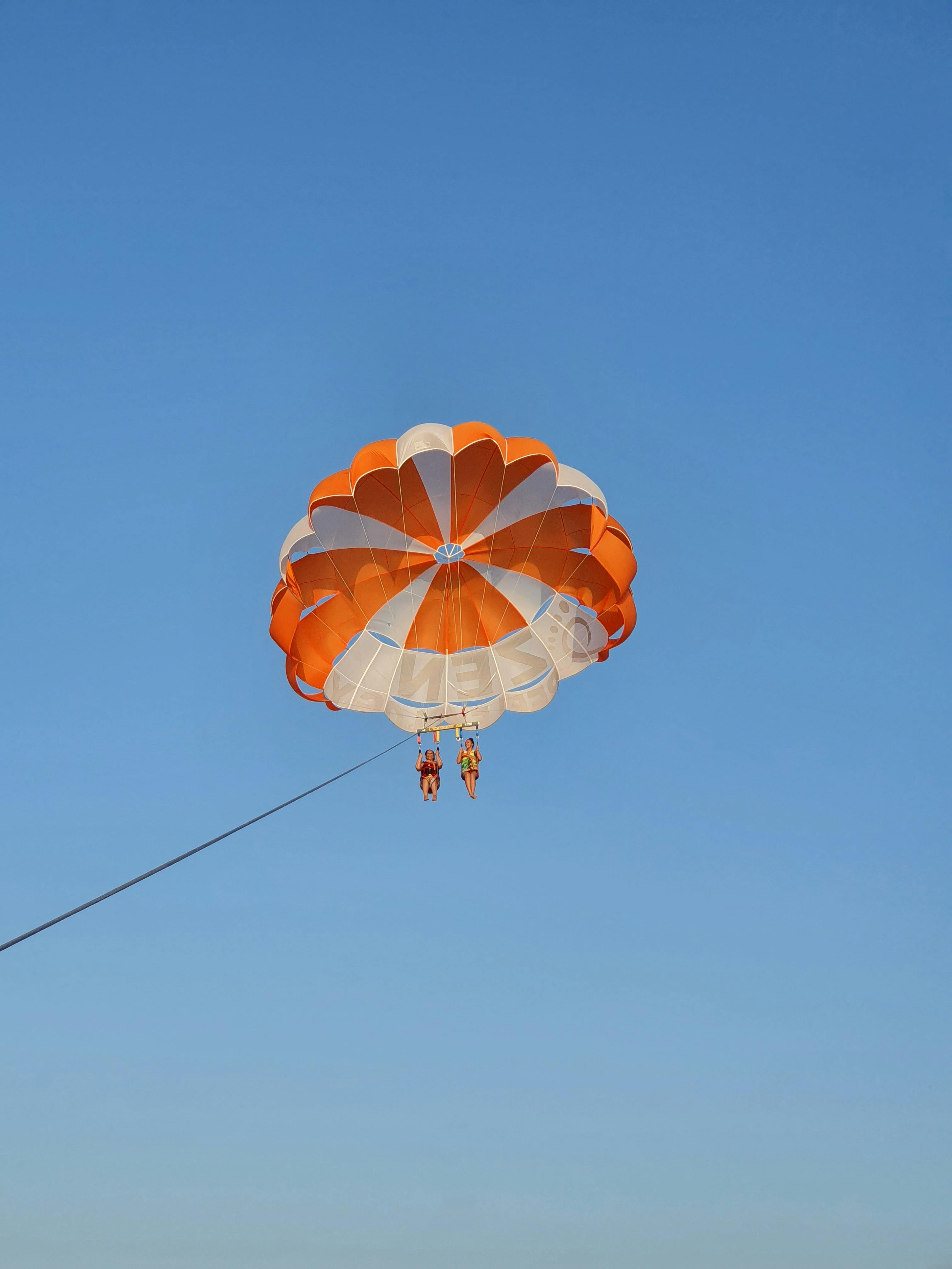 People Flying with Parachute · Free Stock Photo
