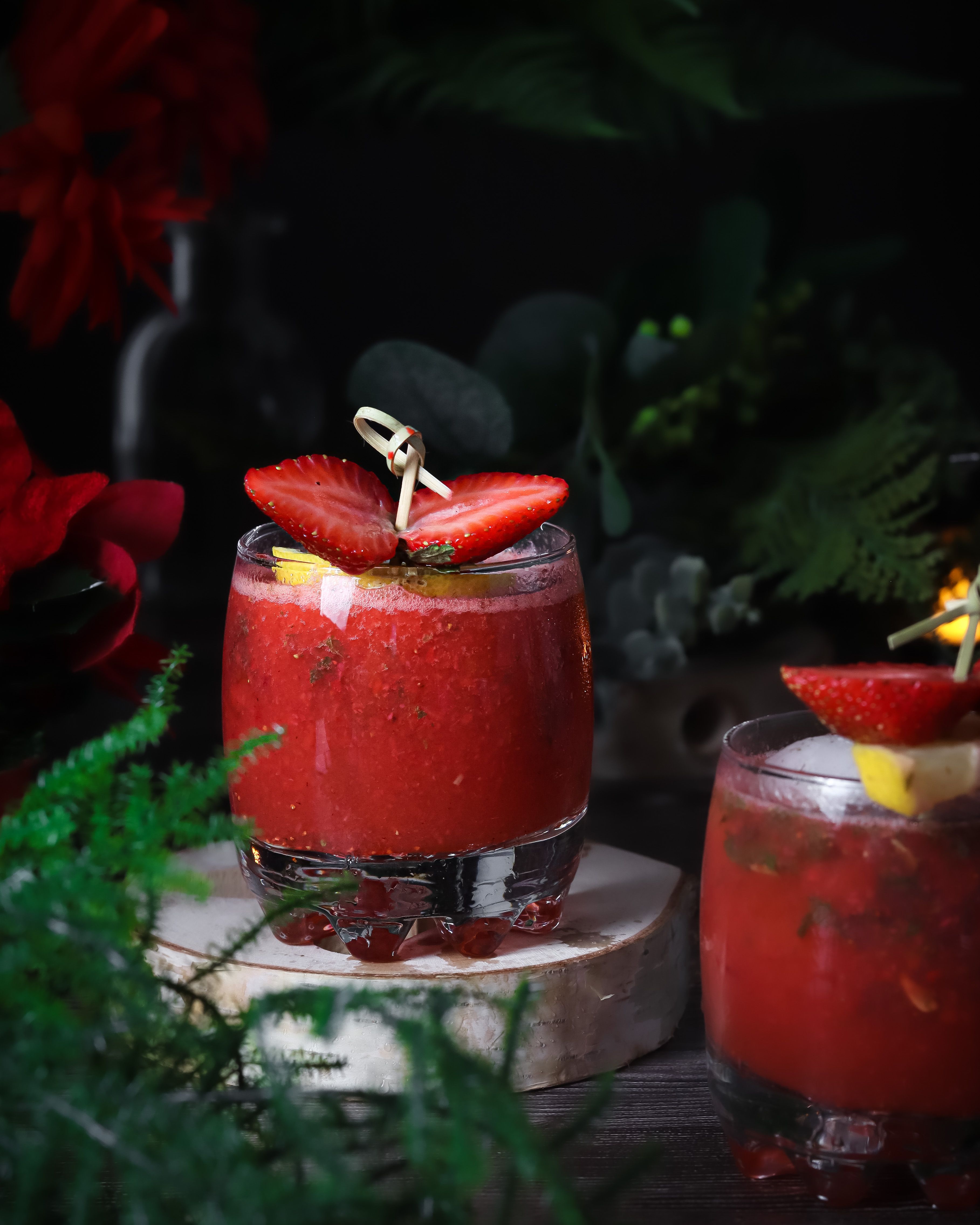 Smoothie Decorated with Strawberry Slices and Flowers · Free Stock Photo