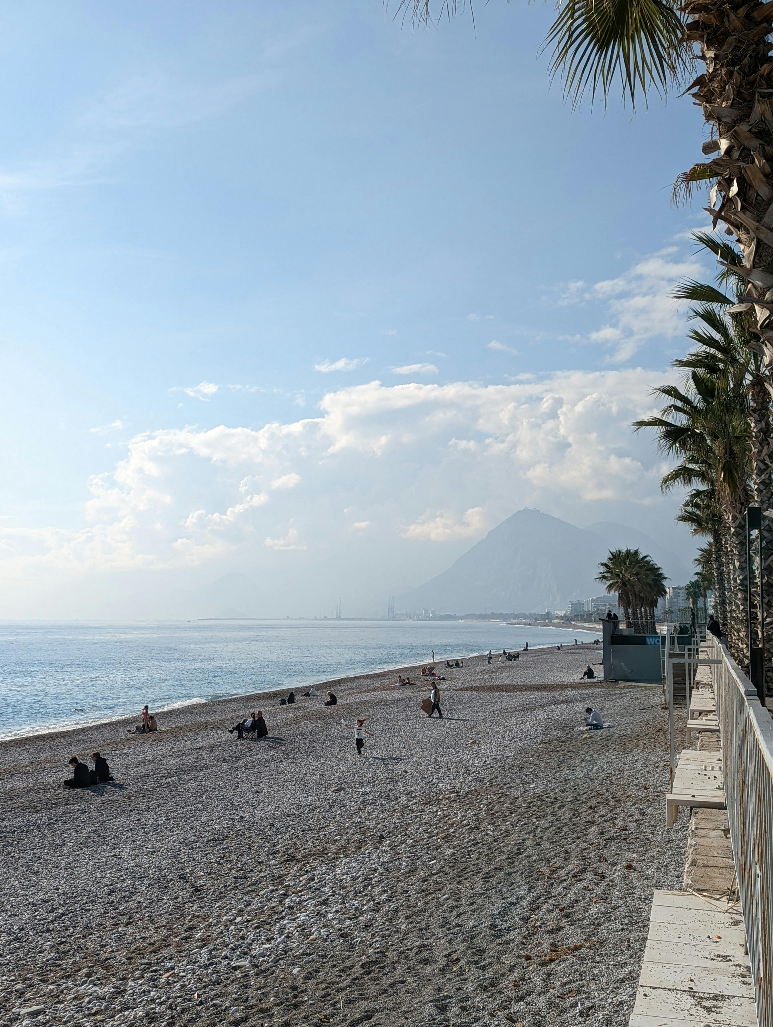 Holidaymaker Lying On Idyllic Beach With Arms Spread · Free Stock Photo