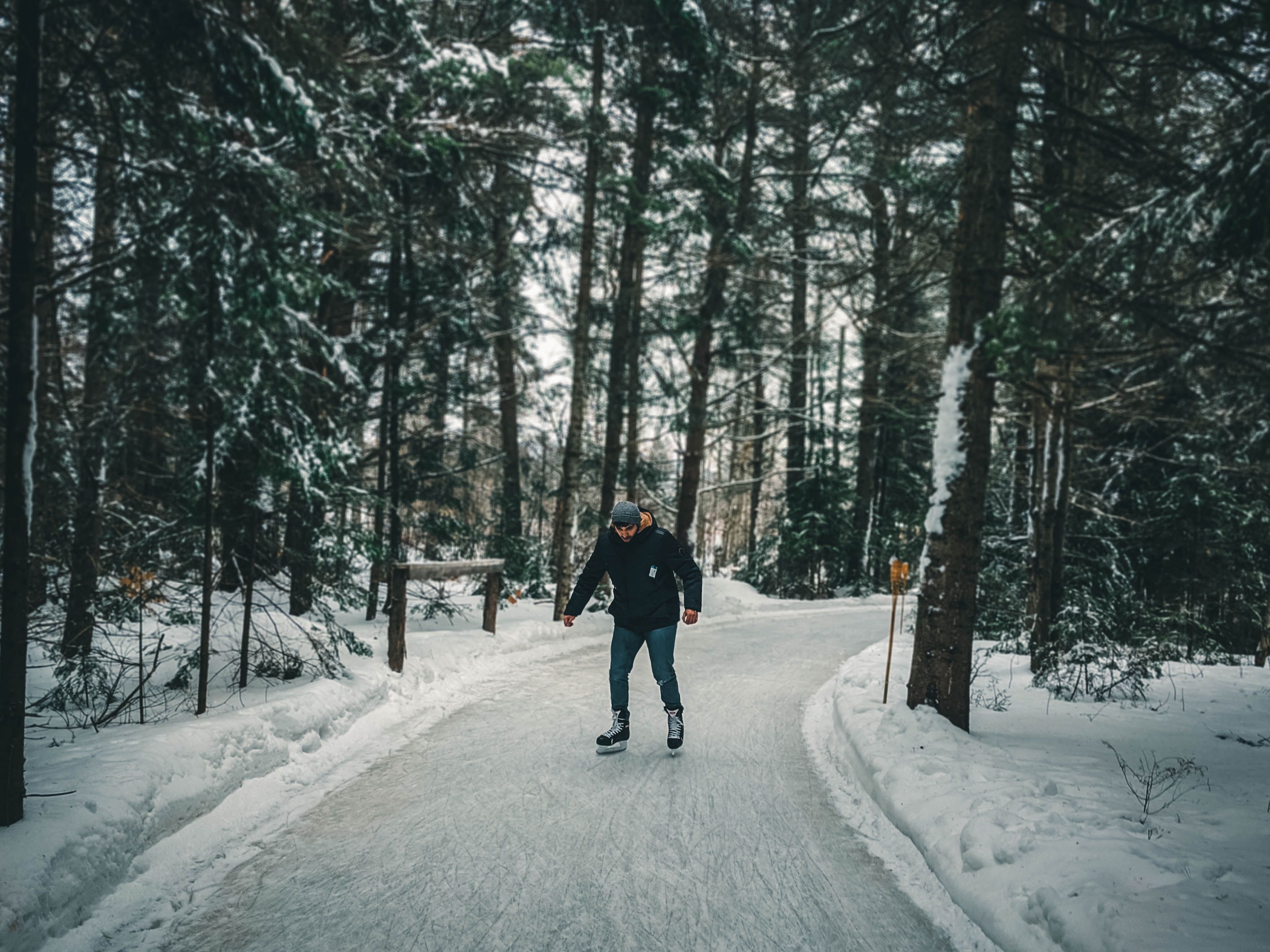 A Man Skating on Snow Covered Ground · Free Stock Photo