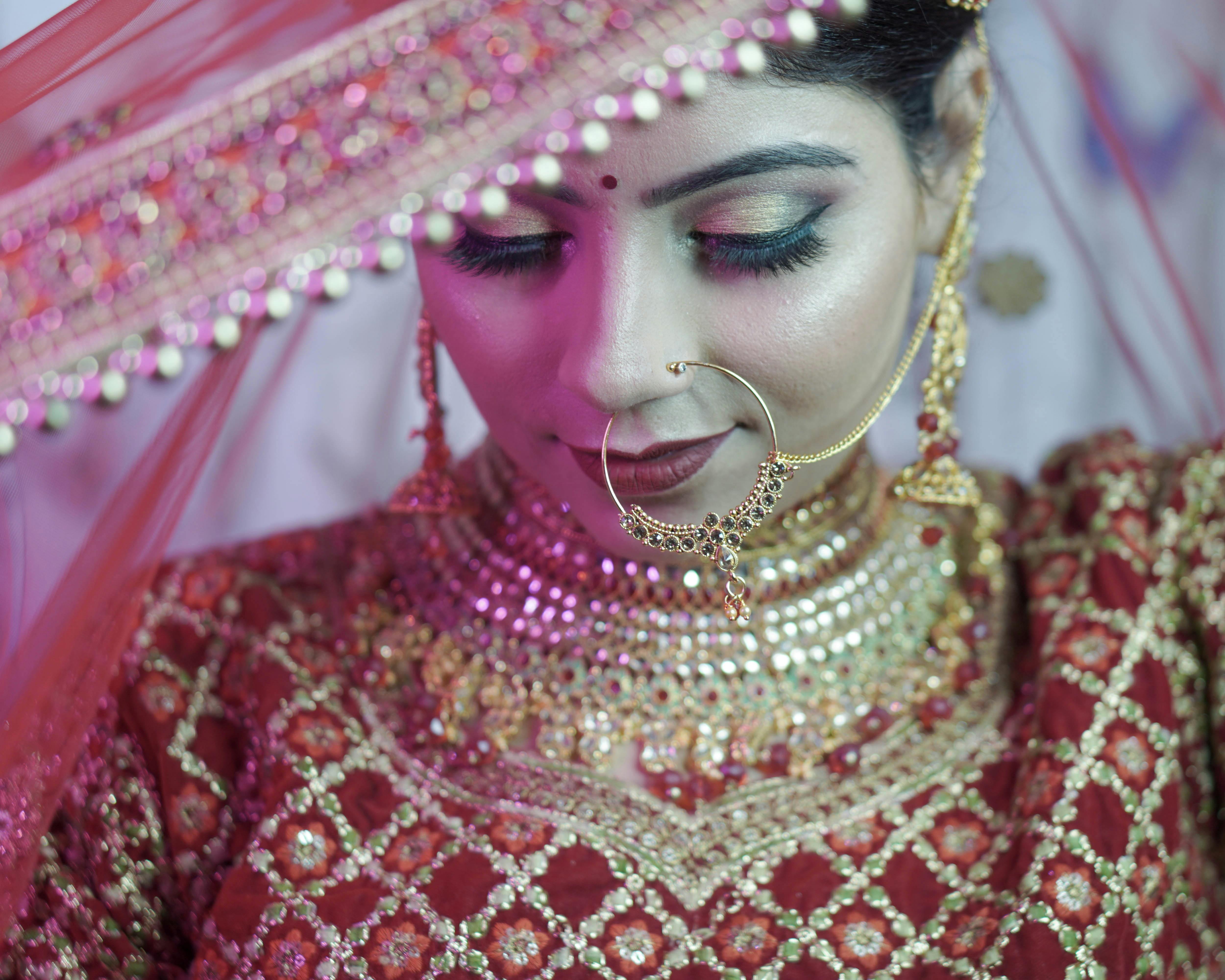 Photo of a Woman Wearing a Traditional Red Embroidered Dress and Golden ...