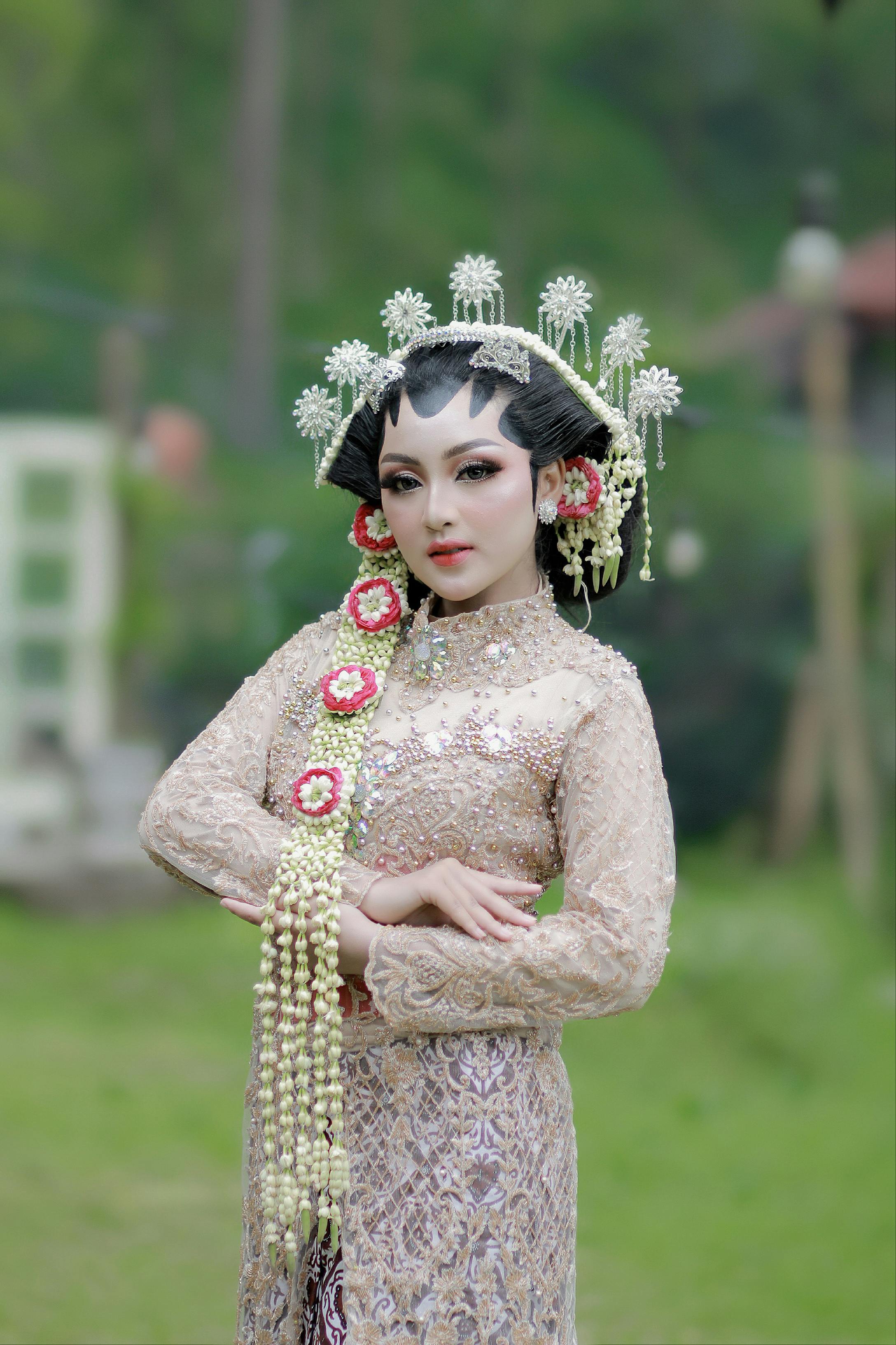 A Beautiful Woman Wearing a Traditional Dress · Free Stock Photo