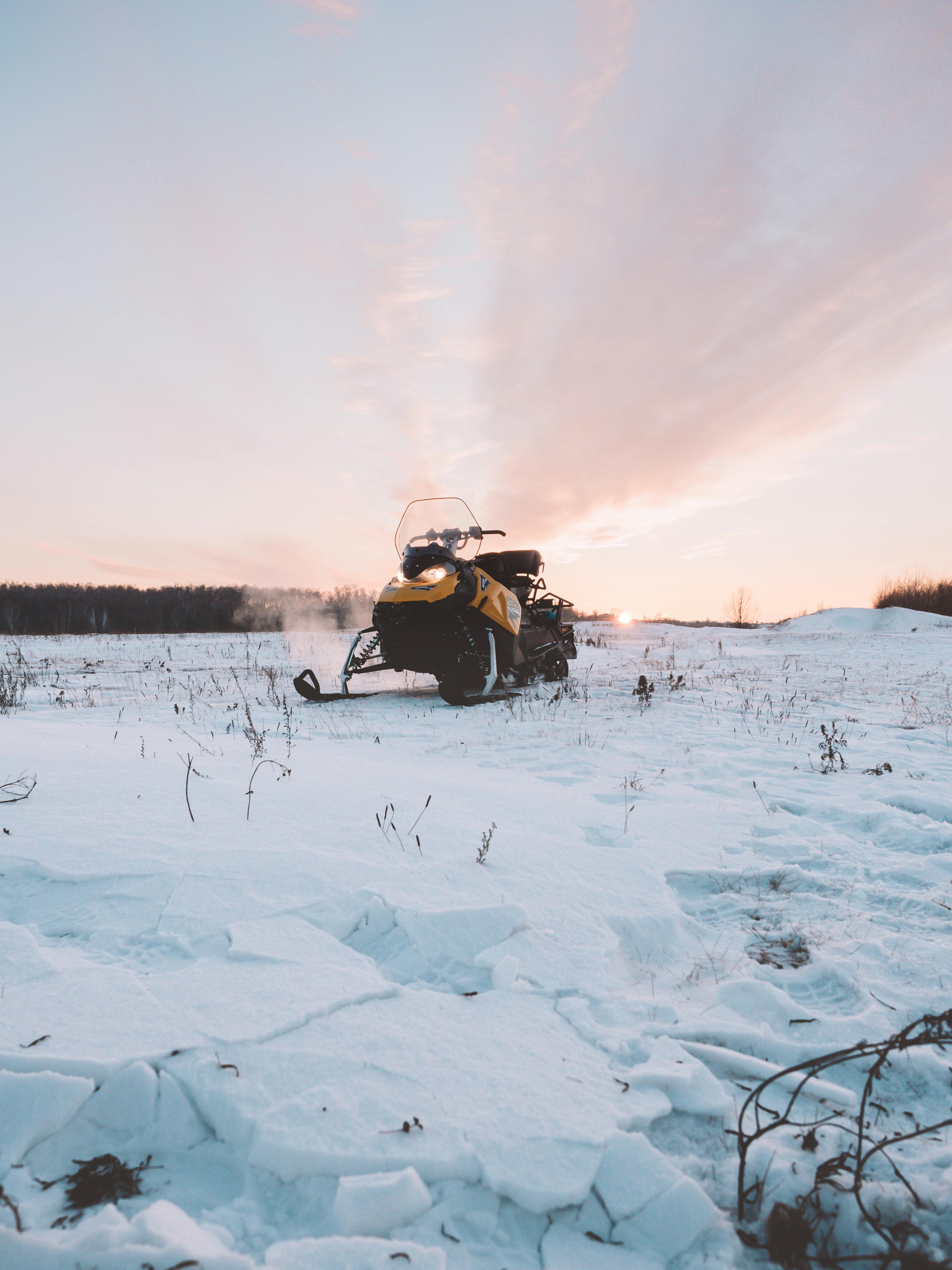 Snowmobile at Sunset · Free Stock Photo