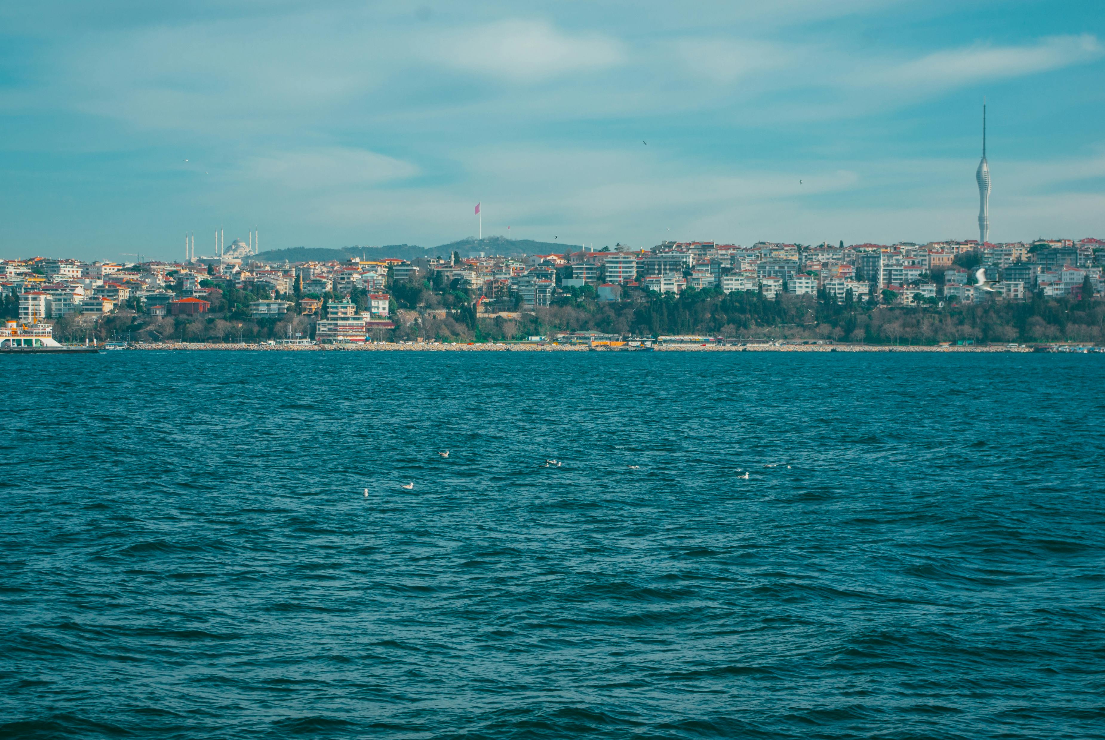 City Skyline Across Body of Water · Free Stock Photo