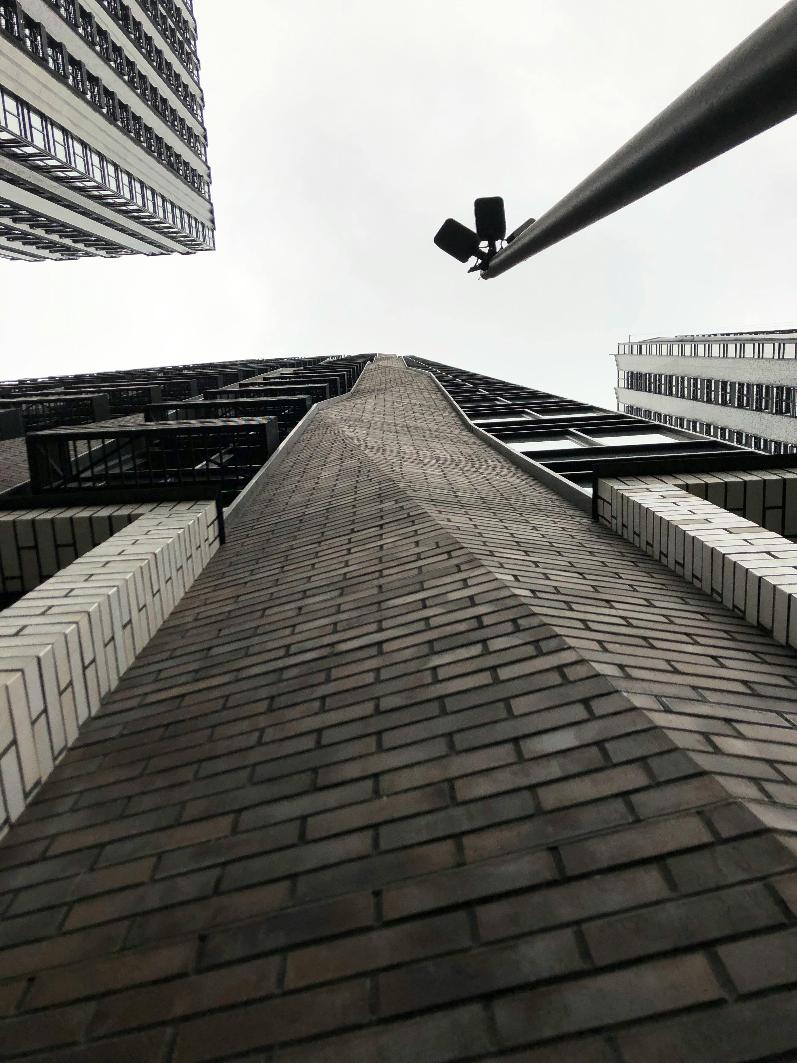 High Rise Buildings Under Cloudy Sky · Free Stock Photo