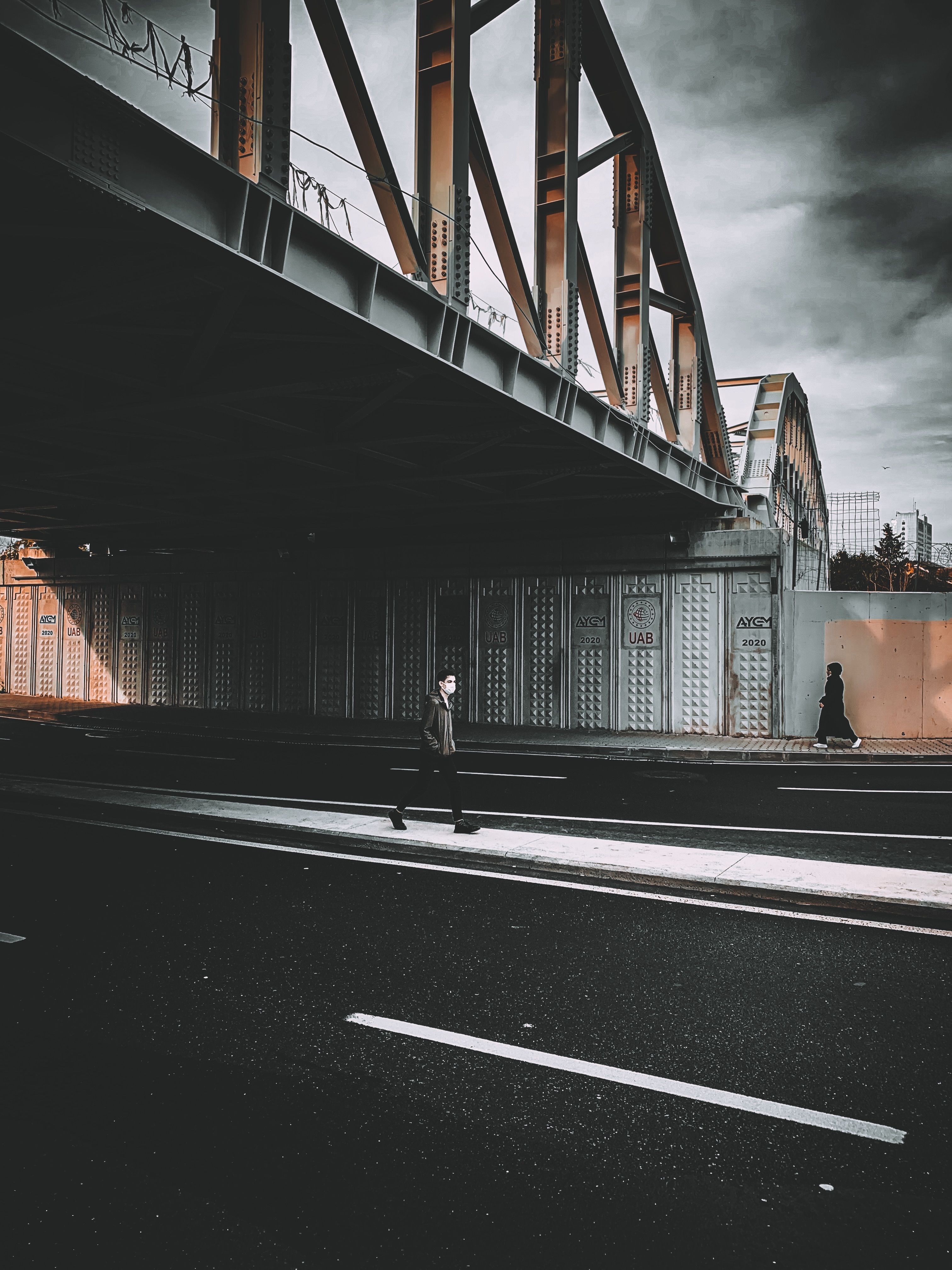 Green Metal Fence on Sidewalk Near High Rise Buildings · Free Stock Photo